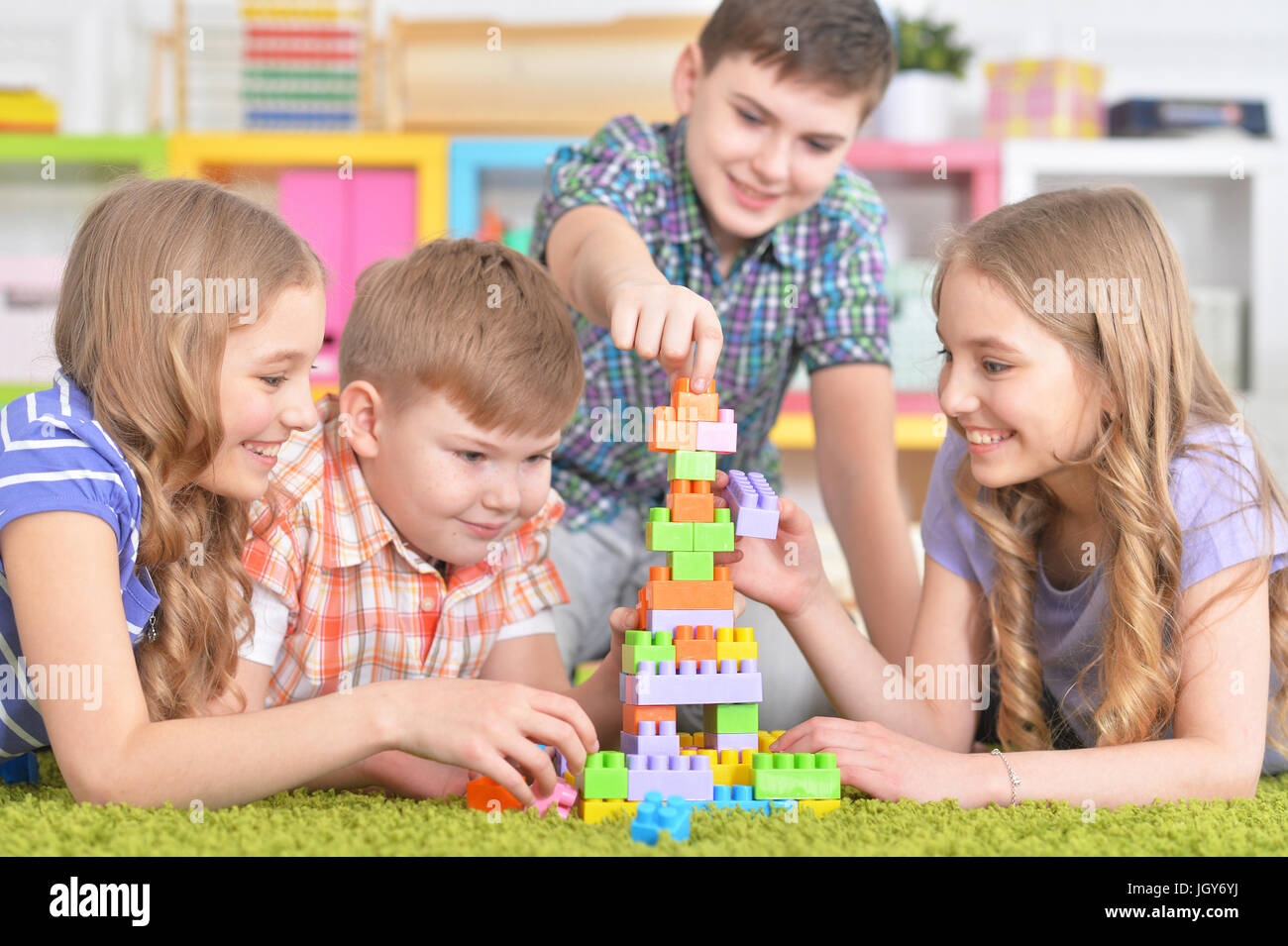 Group of children playing together Stock Photo - Alamy