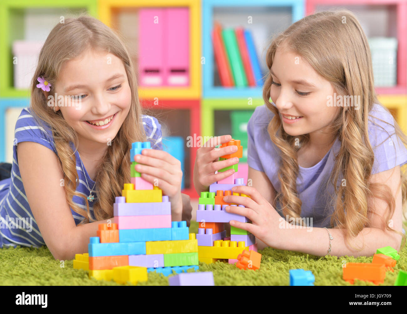 Cute girls playing together Stock Photo - Alamy