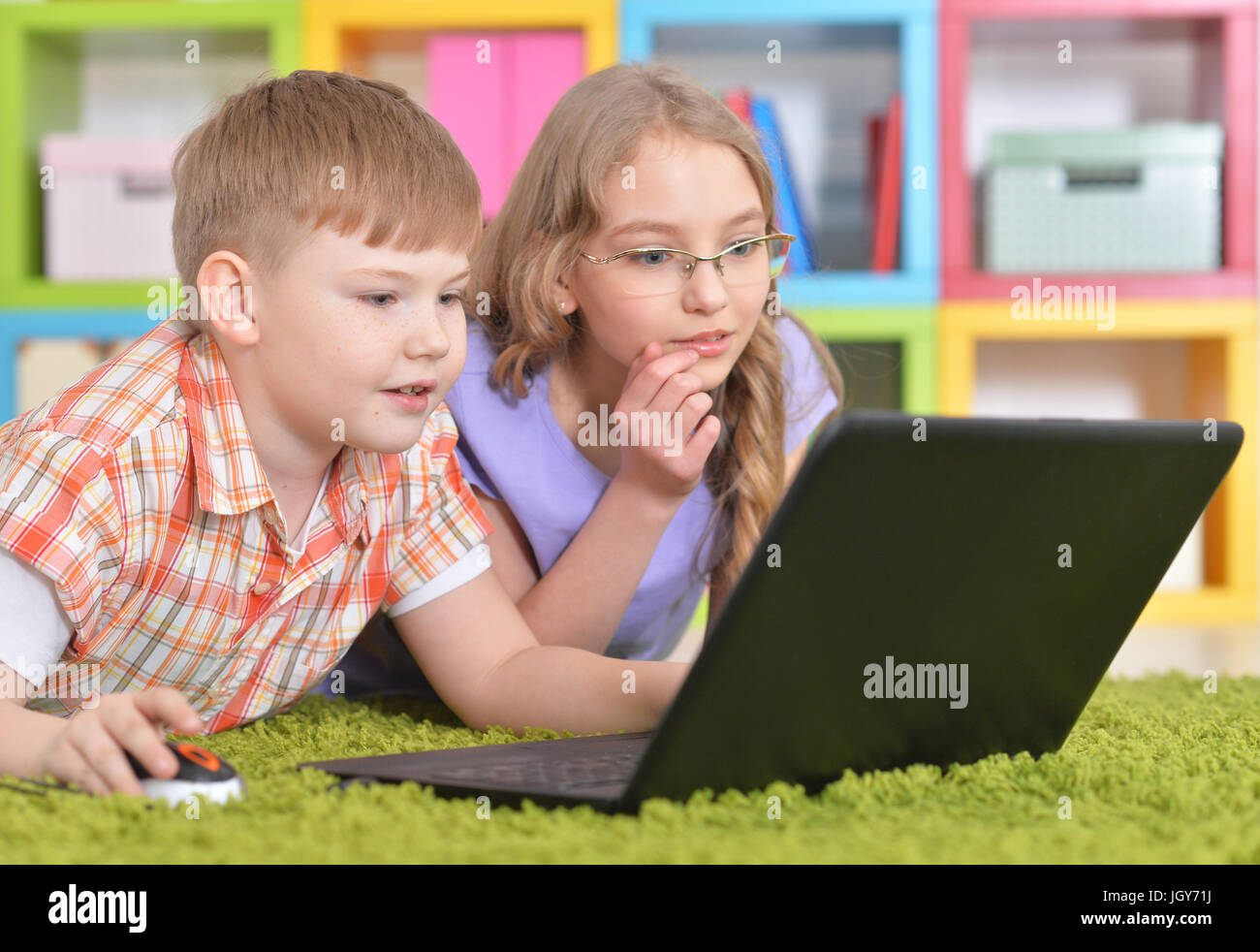 teenagers in front of modern laptop Stock Photo - Alamy