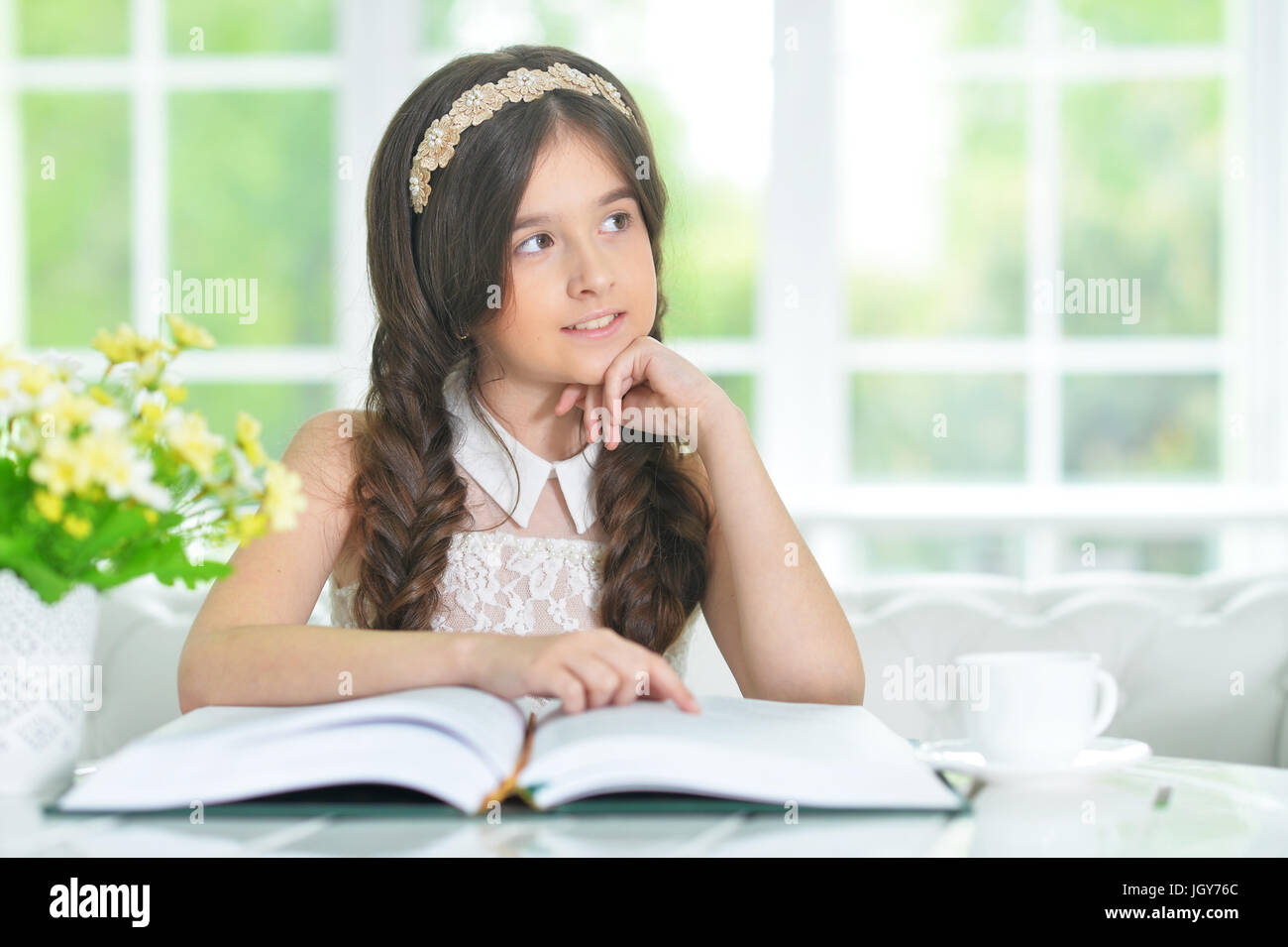 little cute girl reading book Stock Photo - Alamy