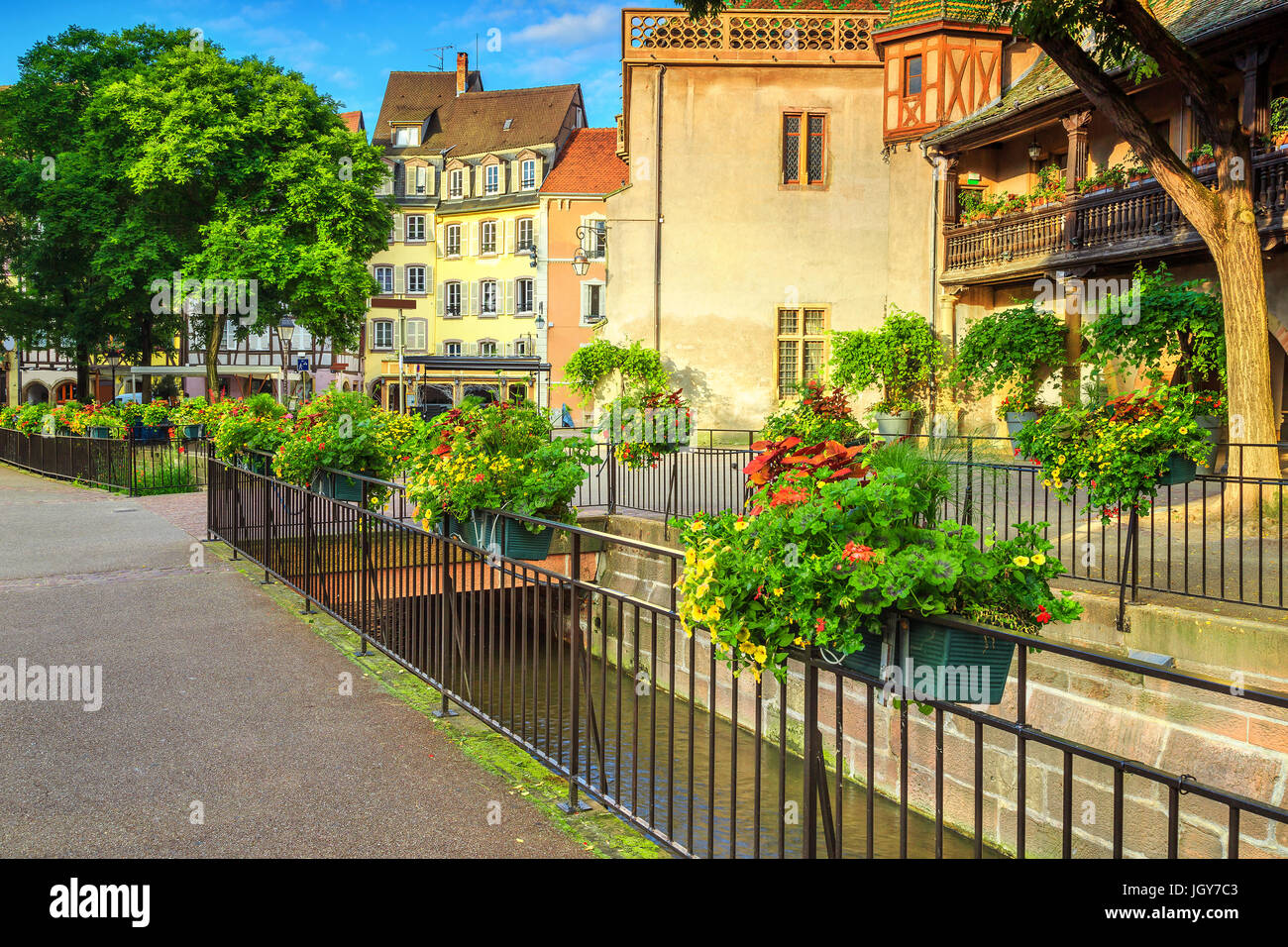 Stunning colorful traditional French houses and decorated street with ...