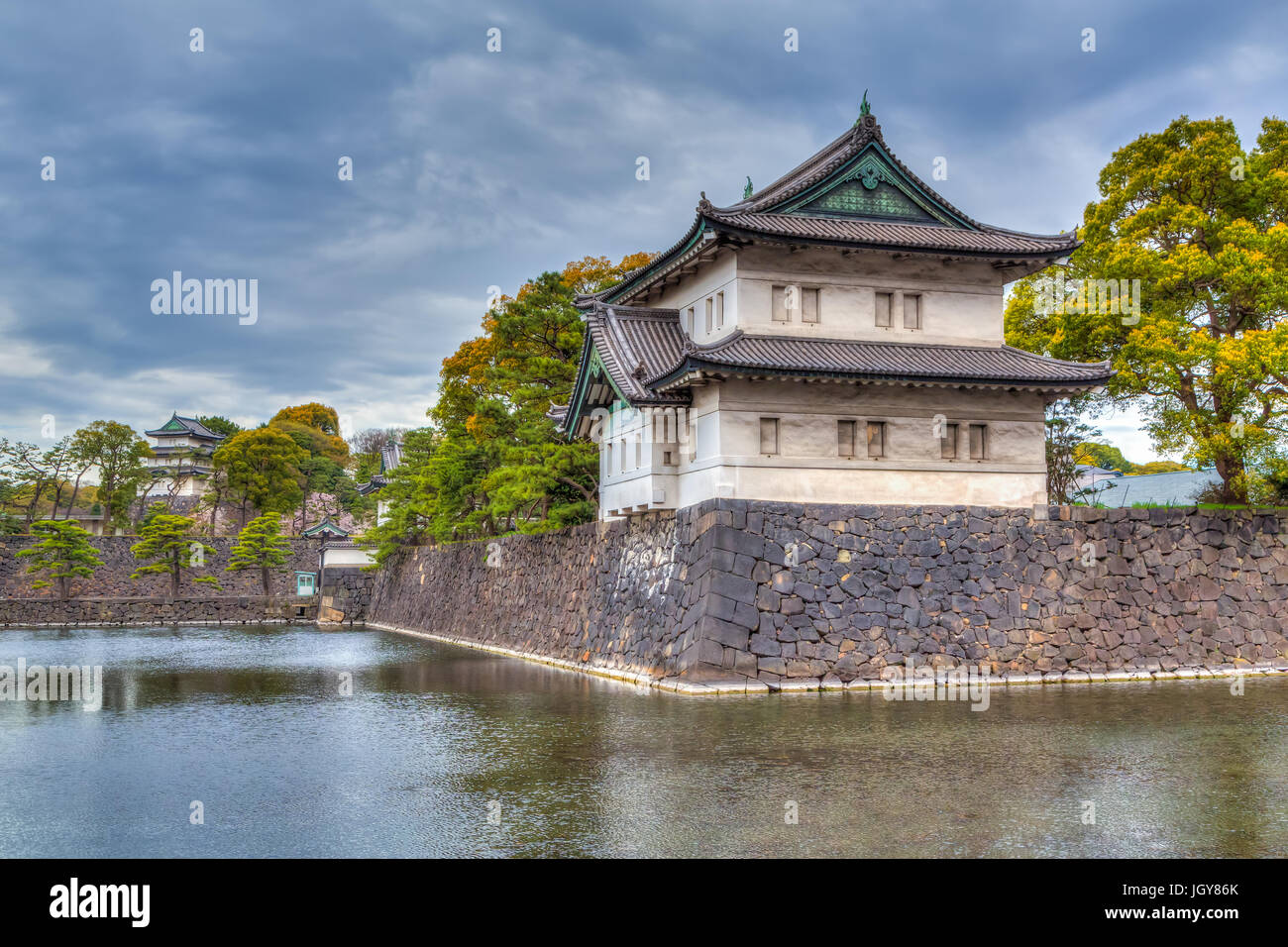The Imperial Palace buildings reflected in the moat in Tokyo, Japan ...