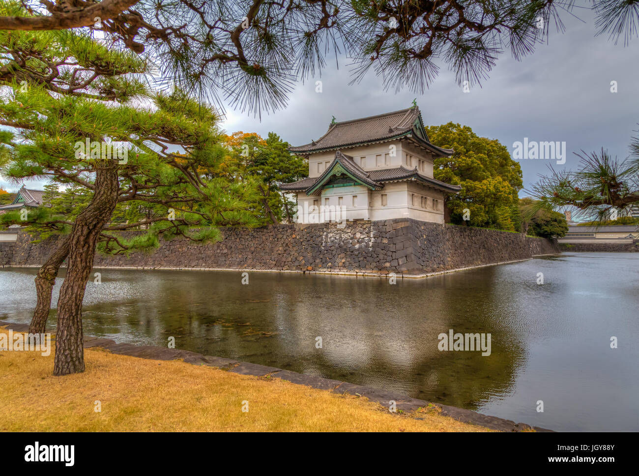 The Imperial Palace buildings reflected in the moat in Tokyo, Japan ...