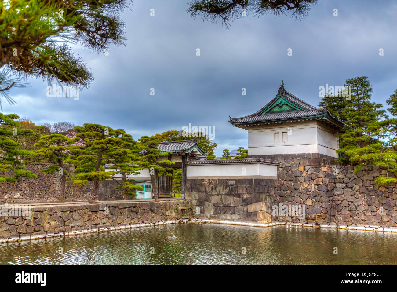 The Imperial Palace buildings reflected in the moat in Tokyo, Japan ...
