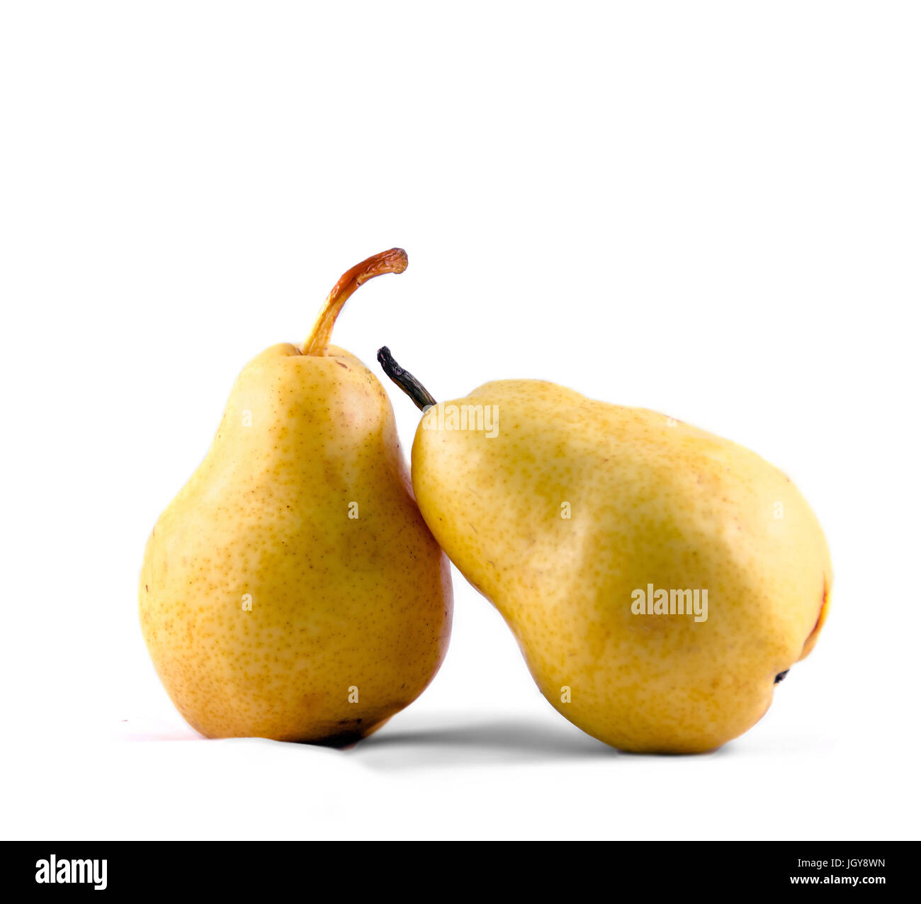 Yellow pears fruits close up, white background Stock Photo - Alamy