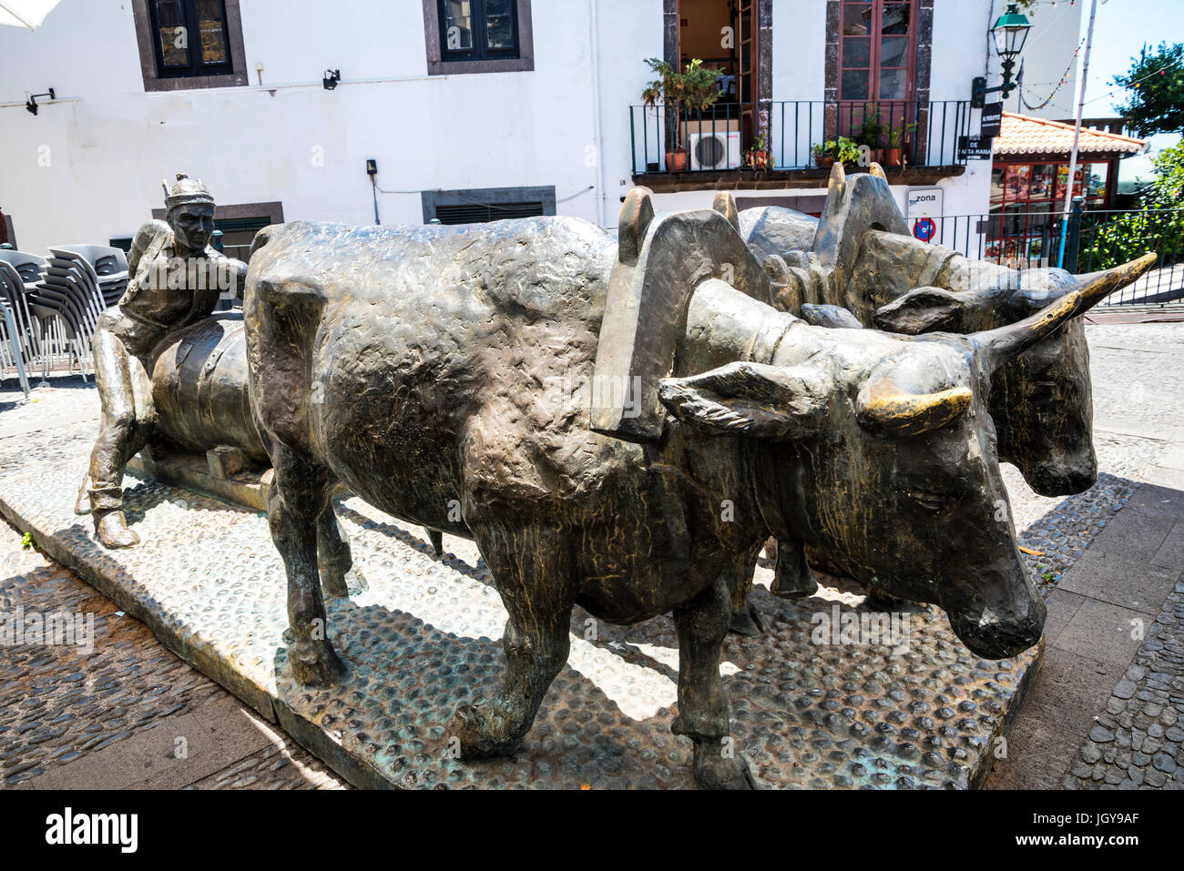 Bronze Statue of Oxen and their Driver pulling goods on wooden runners ...