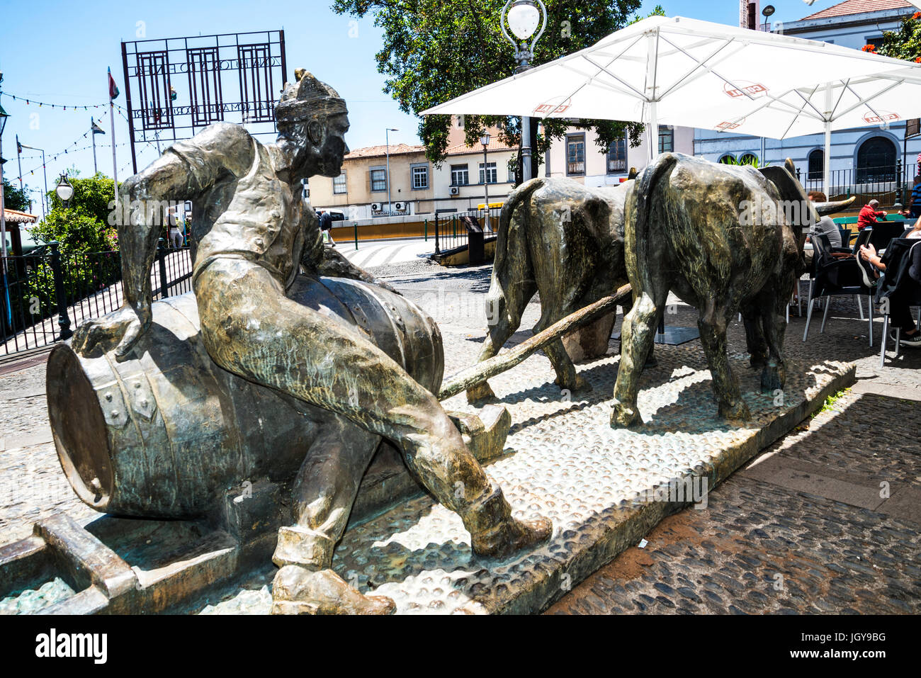Bronze Statue of Oxen and their Driver pulling goods on wooden runners ...