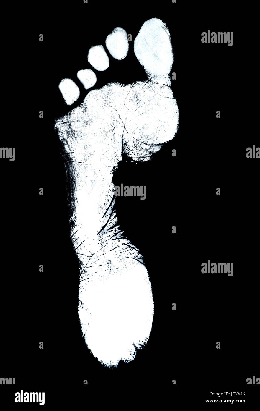 Human foot print on black background Stock Photo - Alamy