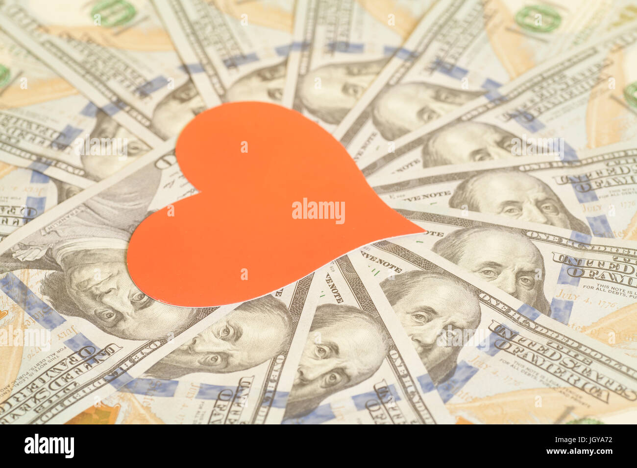 Red paper heart and hundred dollar bills for background Stock Photo - Alamy