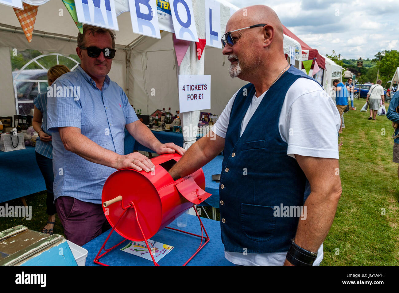 A Man Picks A Raffle Ticket From A Lucky Dip (Tombola) At The Fairwarp ...