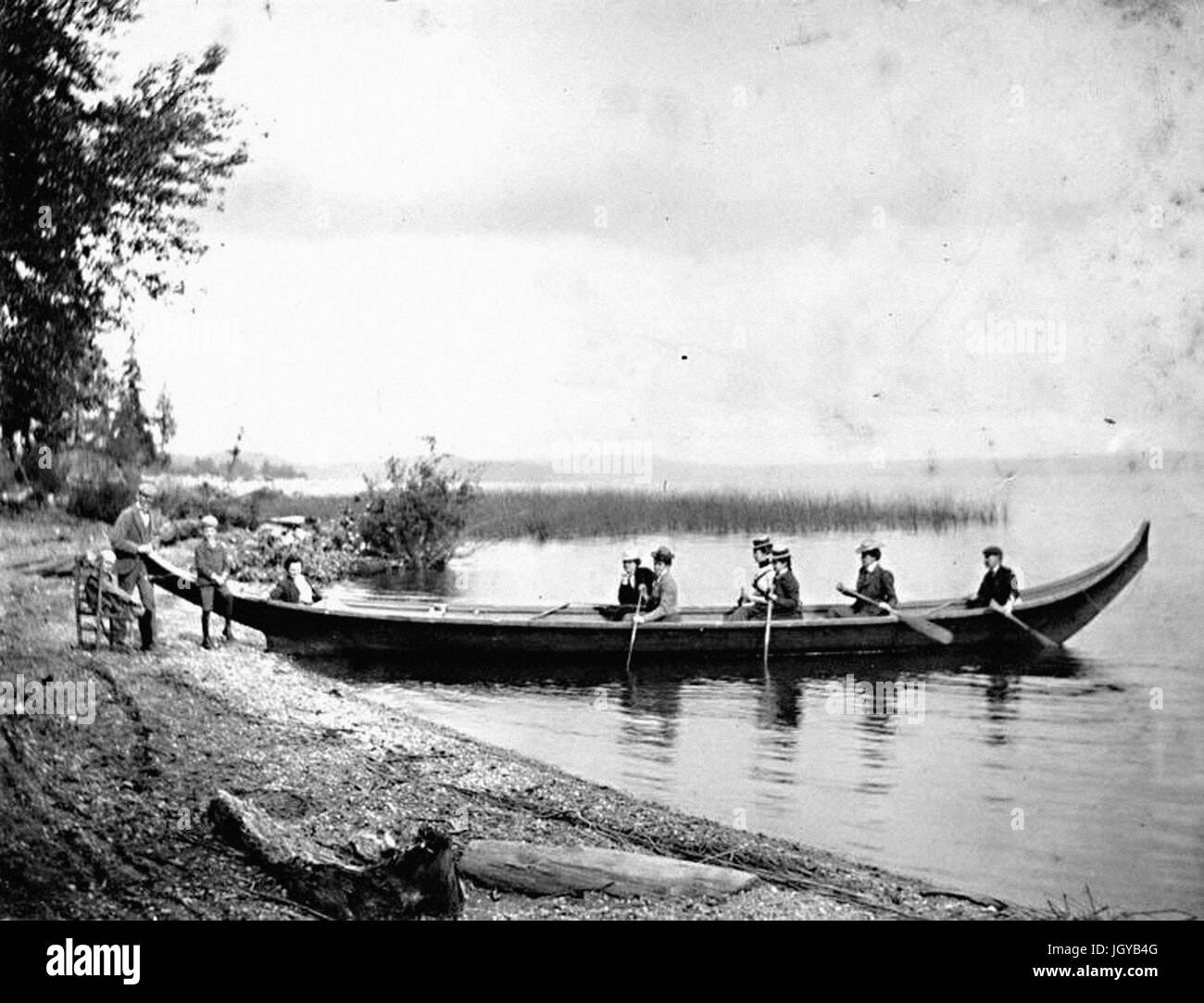 Old Pastimes - Men, women and children on a boating excursion Stock ...