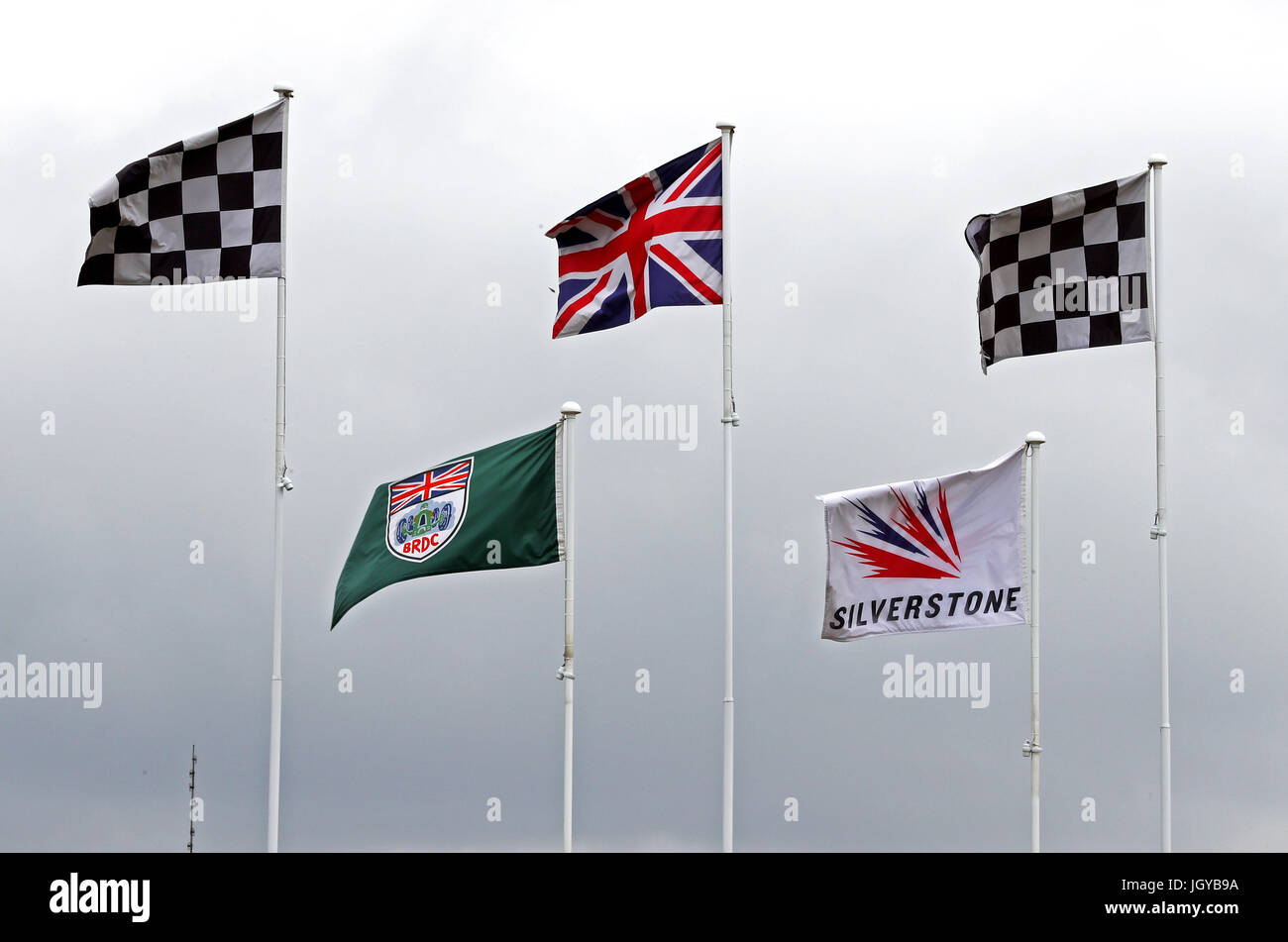 Flags fly at the main entrance to Silverstone Circuit, Towcester Stock ...