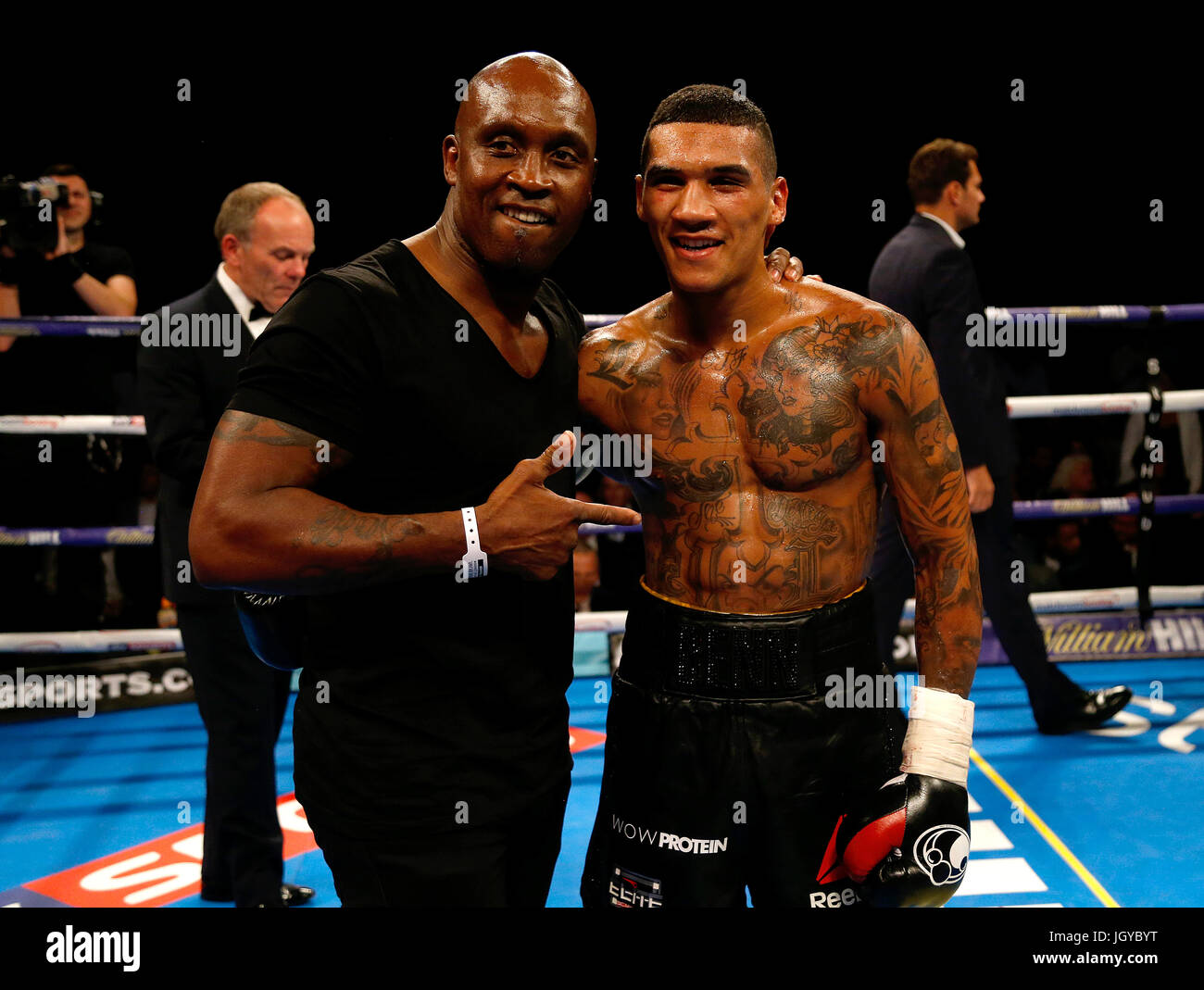 Conor Benn (right) with his father Nigel Benn (left) after beating Mike ...