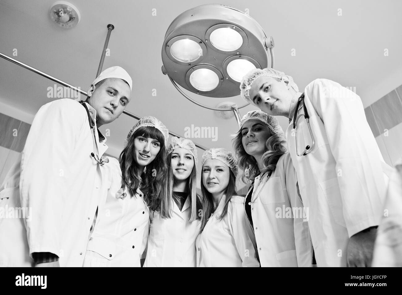 Surgeon standing in operating room Black and White Stock Photos ...