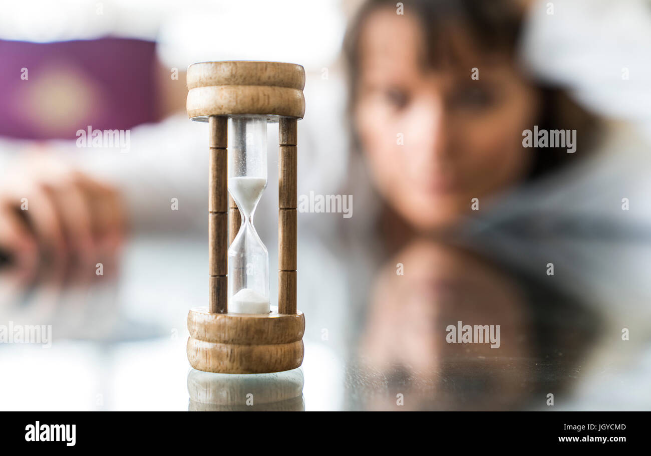 Woman hourglass time hi-res stock photography and images - Alamy