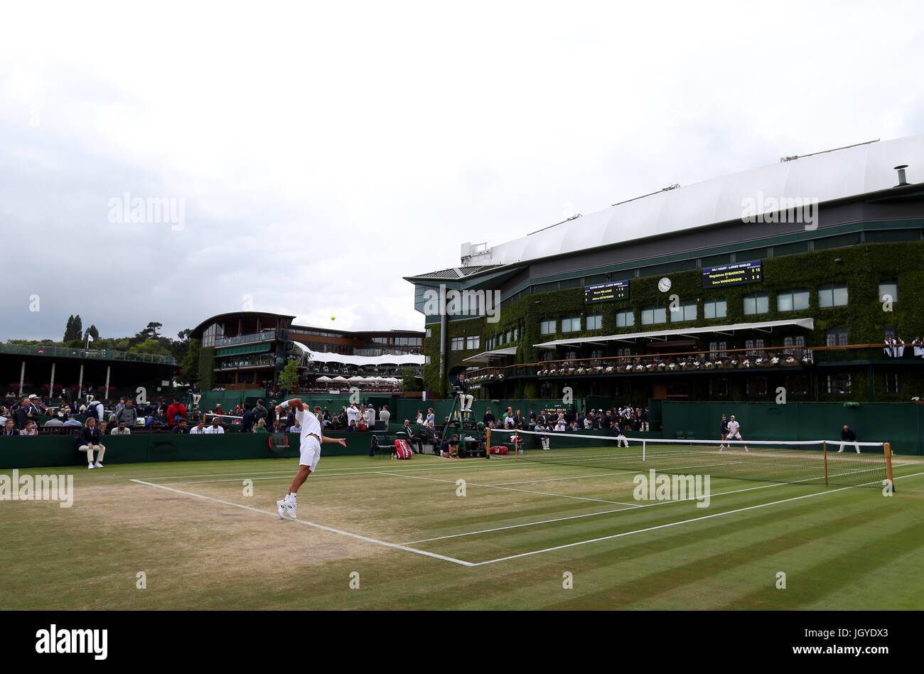 General view of the wear and tear to the grass on the baseline of court ...