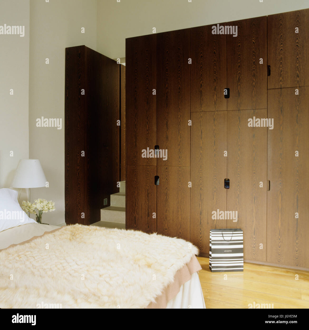 A bedroom with a beamed ceiling Stock Photo - Alamy