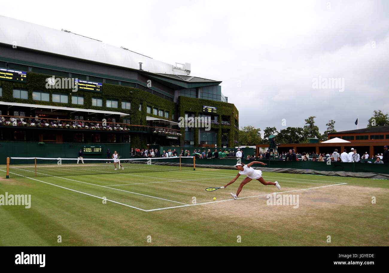General view of the wear and tear to the grass on the baseline of court ...