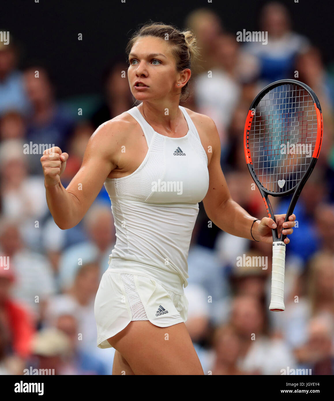 Simona Halep celebrates at the end of the first set against Johanna ...