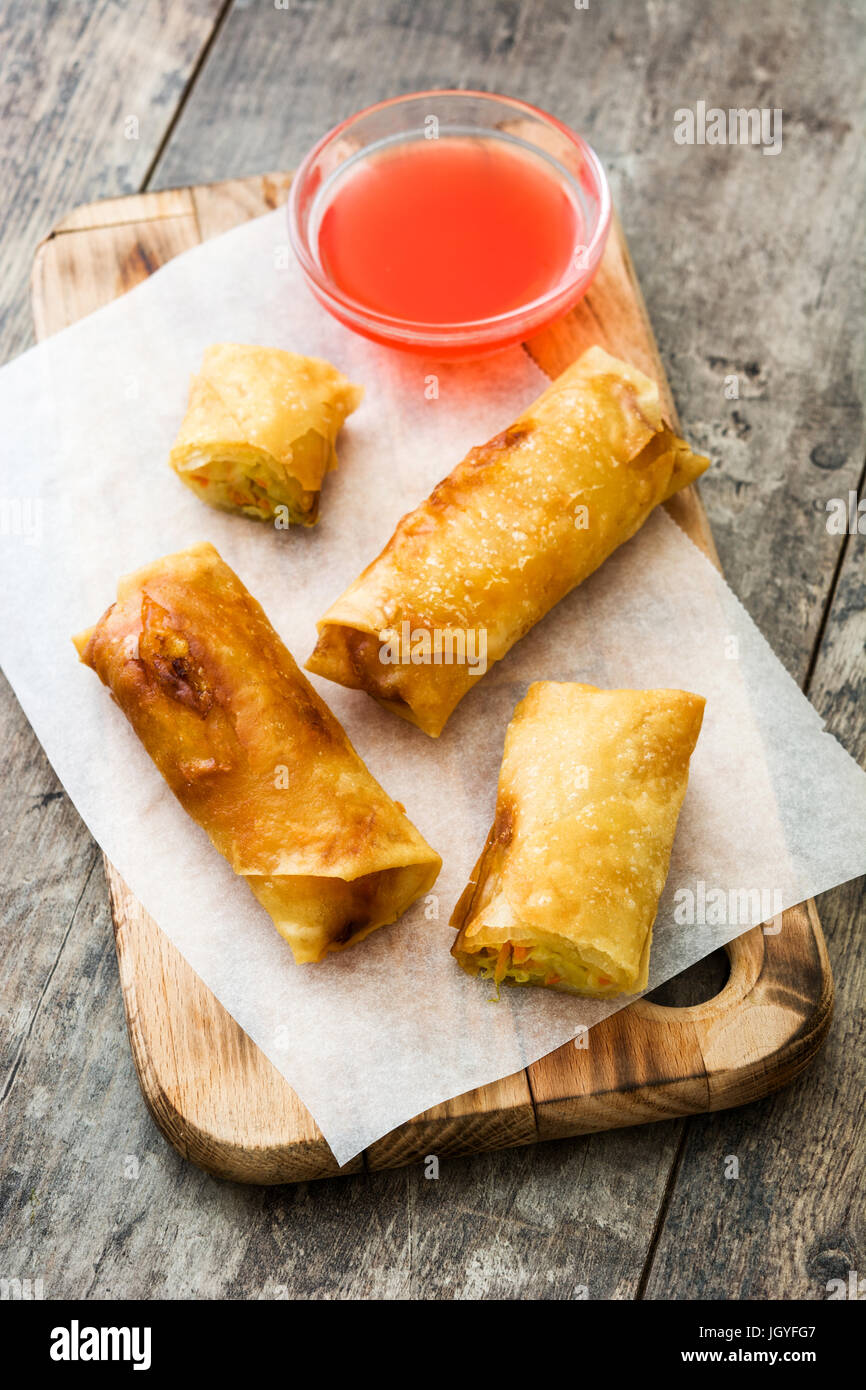 Vegetable spring rolls on wooden table background Stock Photo - Alamy