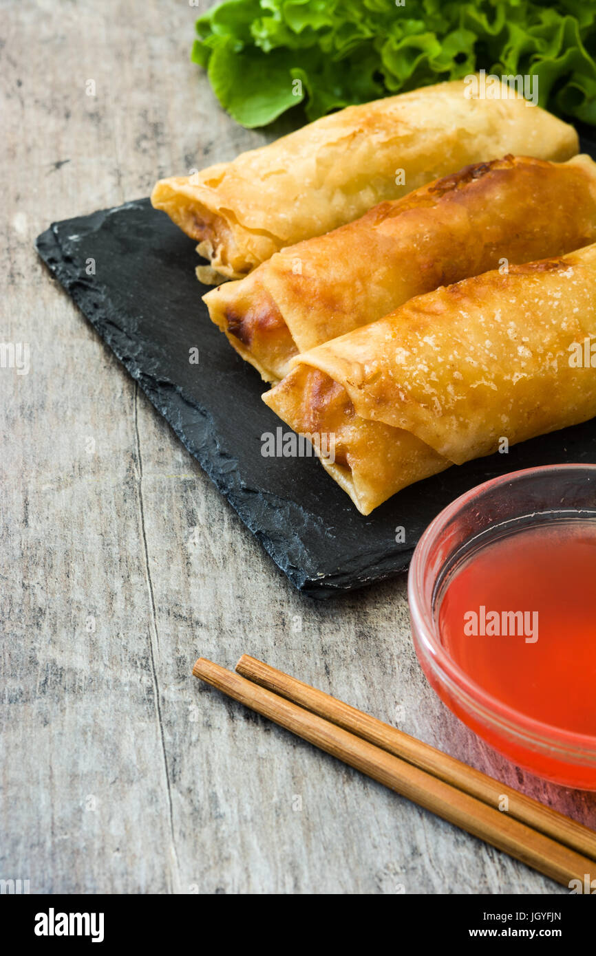 Vegetable spring rolls on wooden table background Stock Photo - Alamy