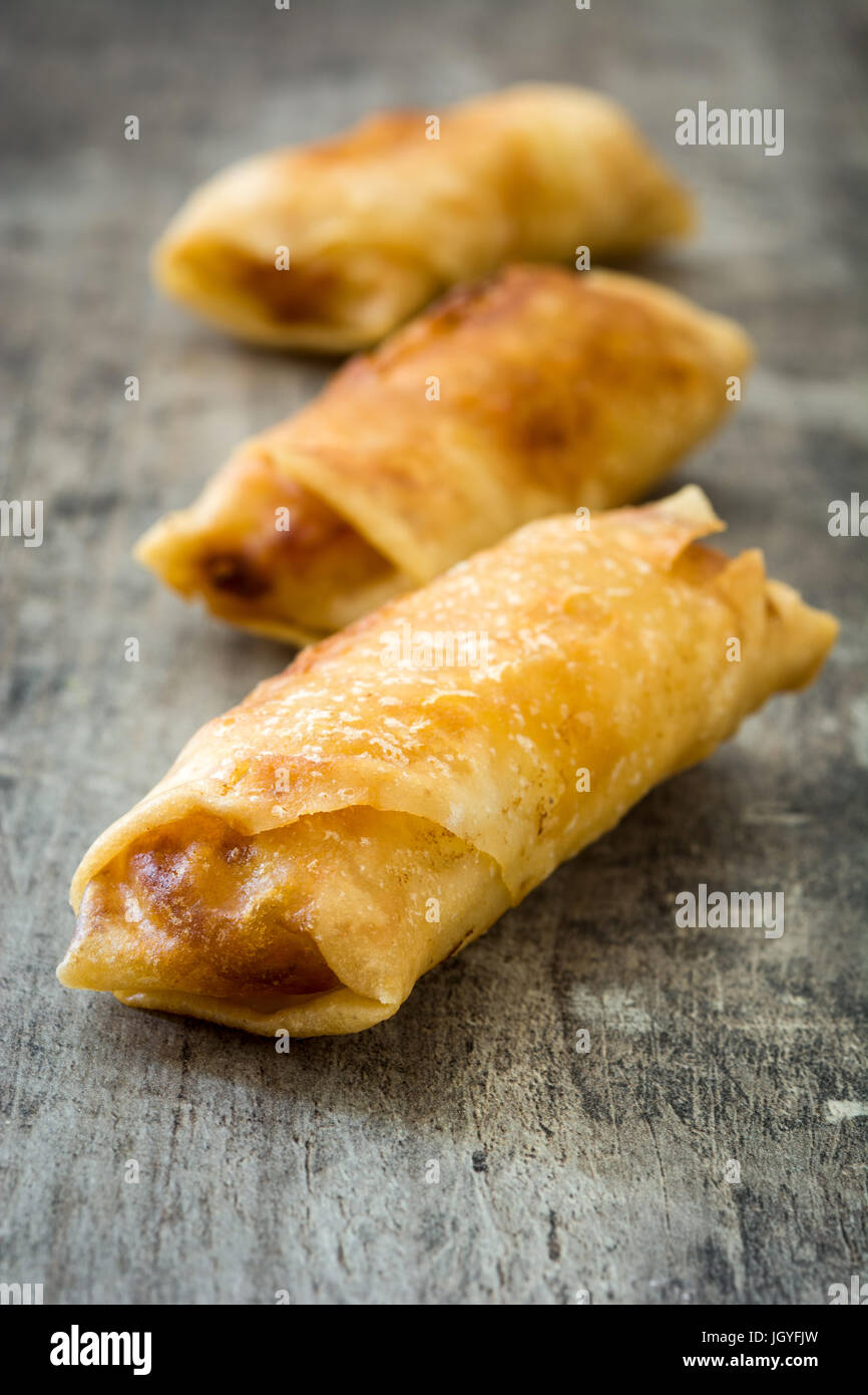 Vegetable spring rolls on wooden table background Stock Photo - Alamy