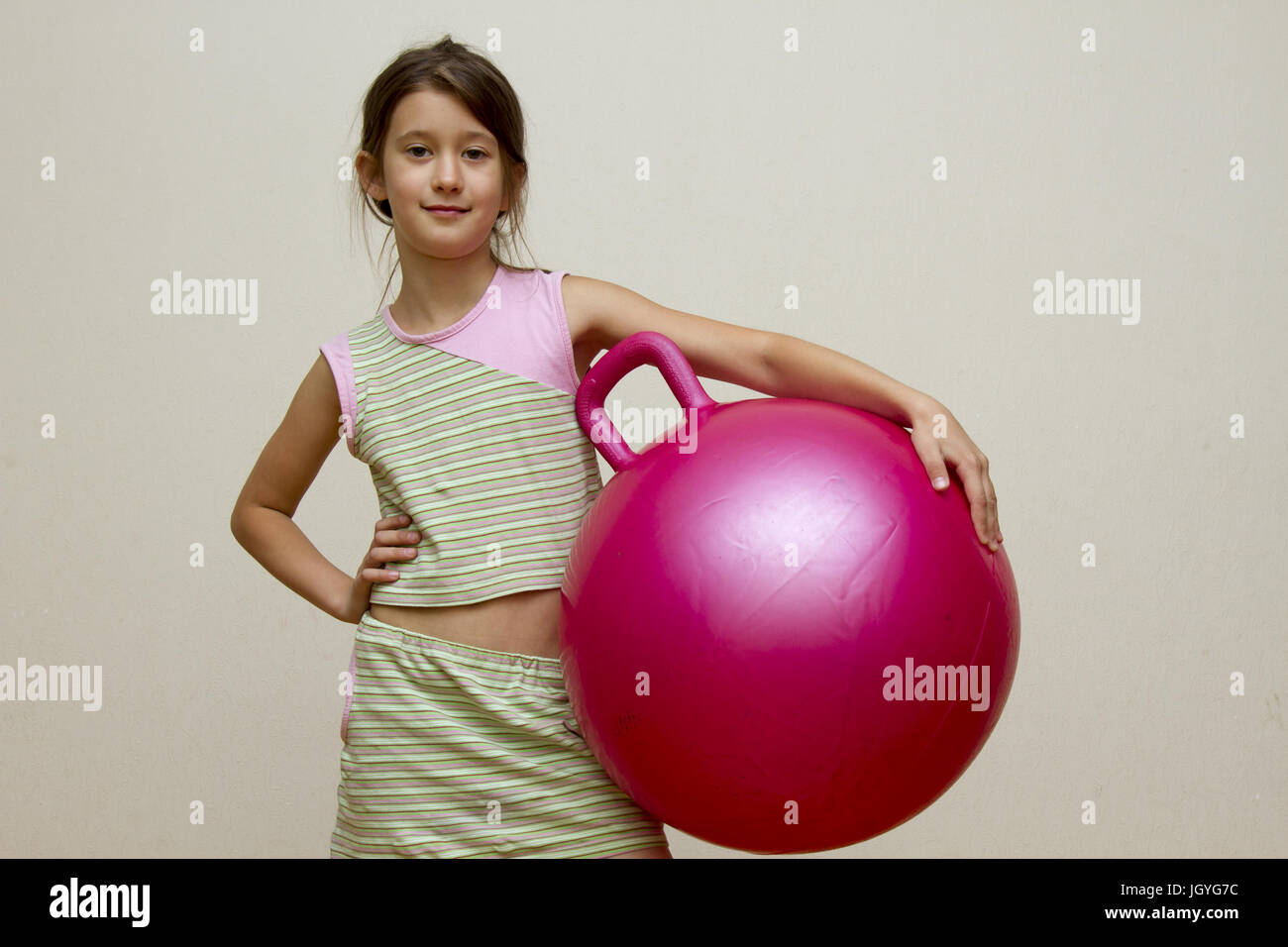 Girl with pink fitness ball Stock Photo - Alamy