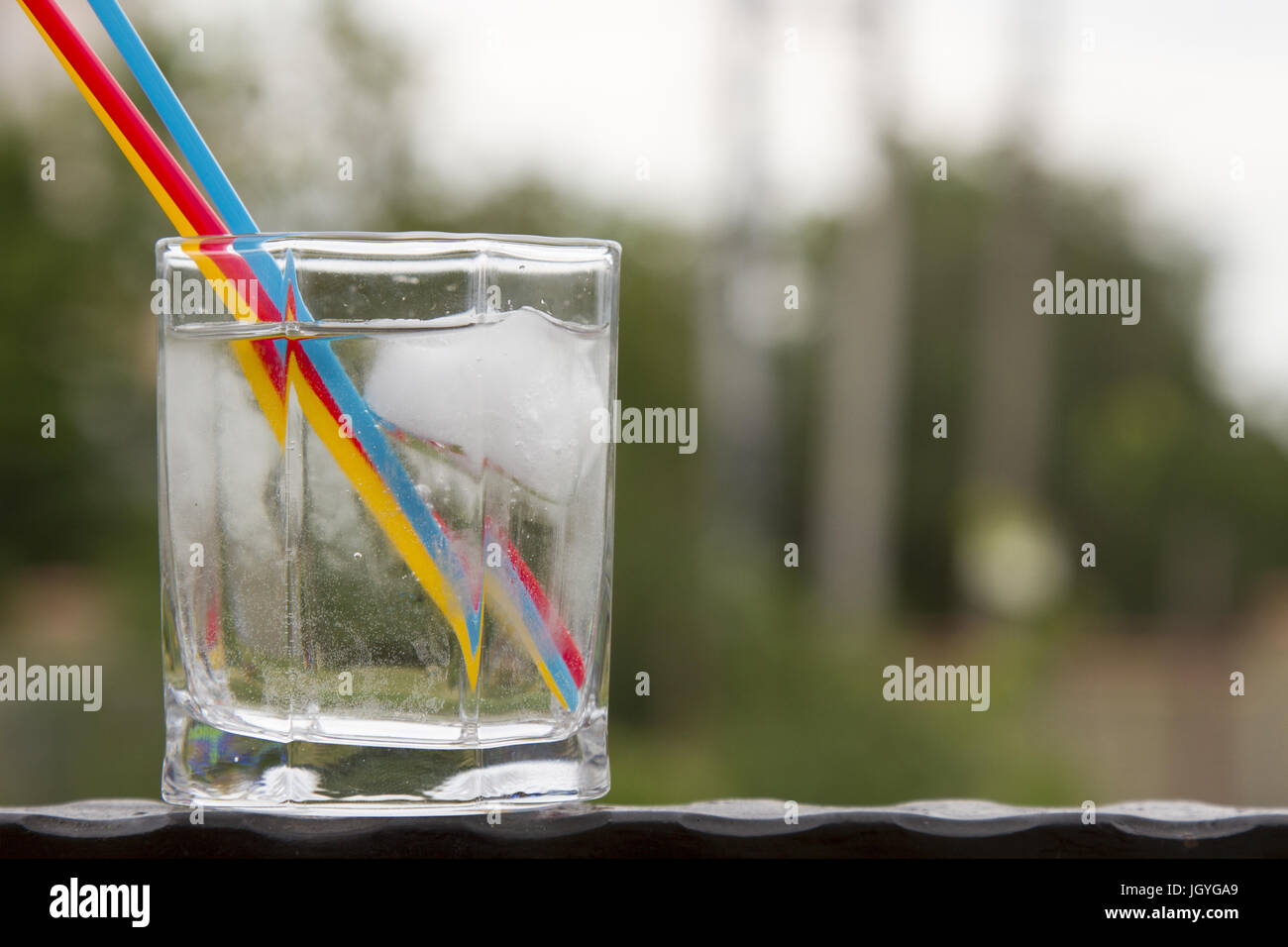 a glass of water with ice on nature background Stock Photo - Alamy