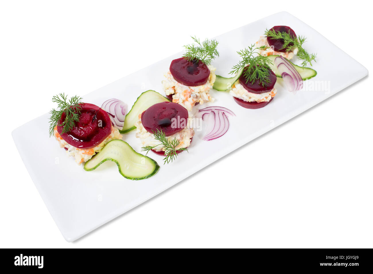Traditional herring salad with beets and onions. Isolated on a white ...