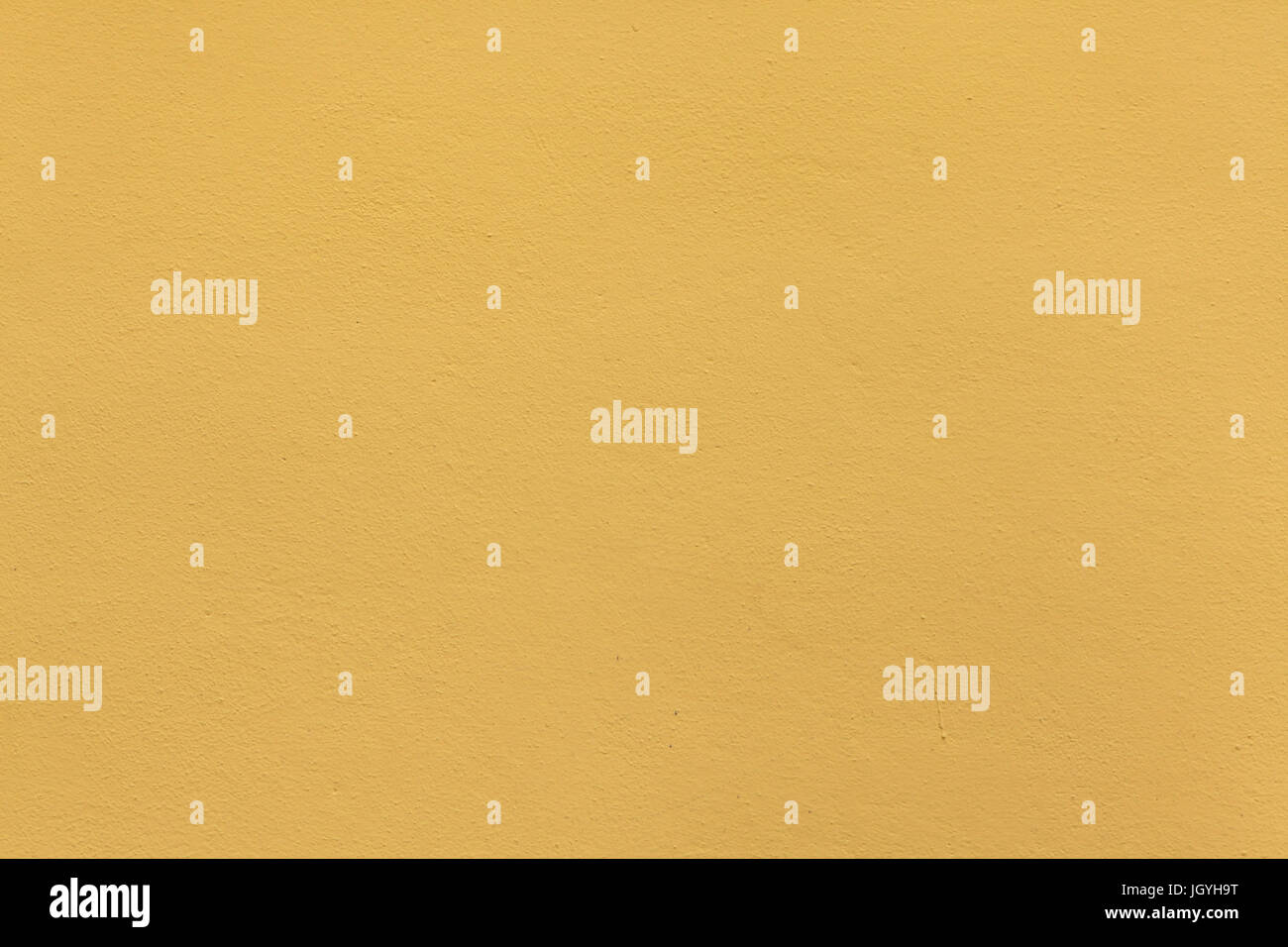 Yellow ochre painted stucco wall. Background texture Stock Photo - Alamy