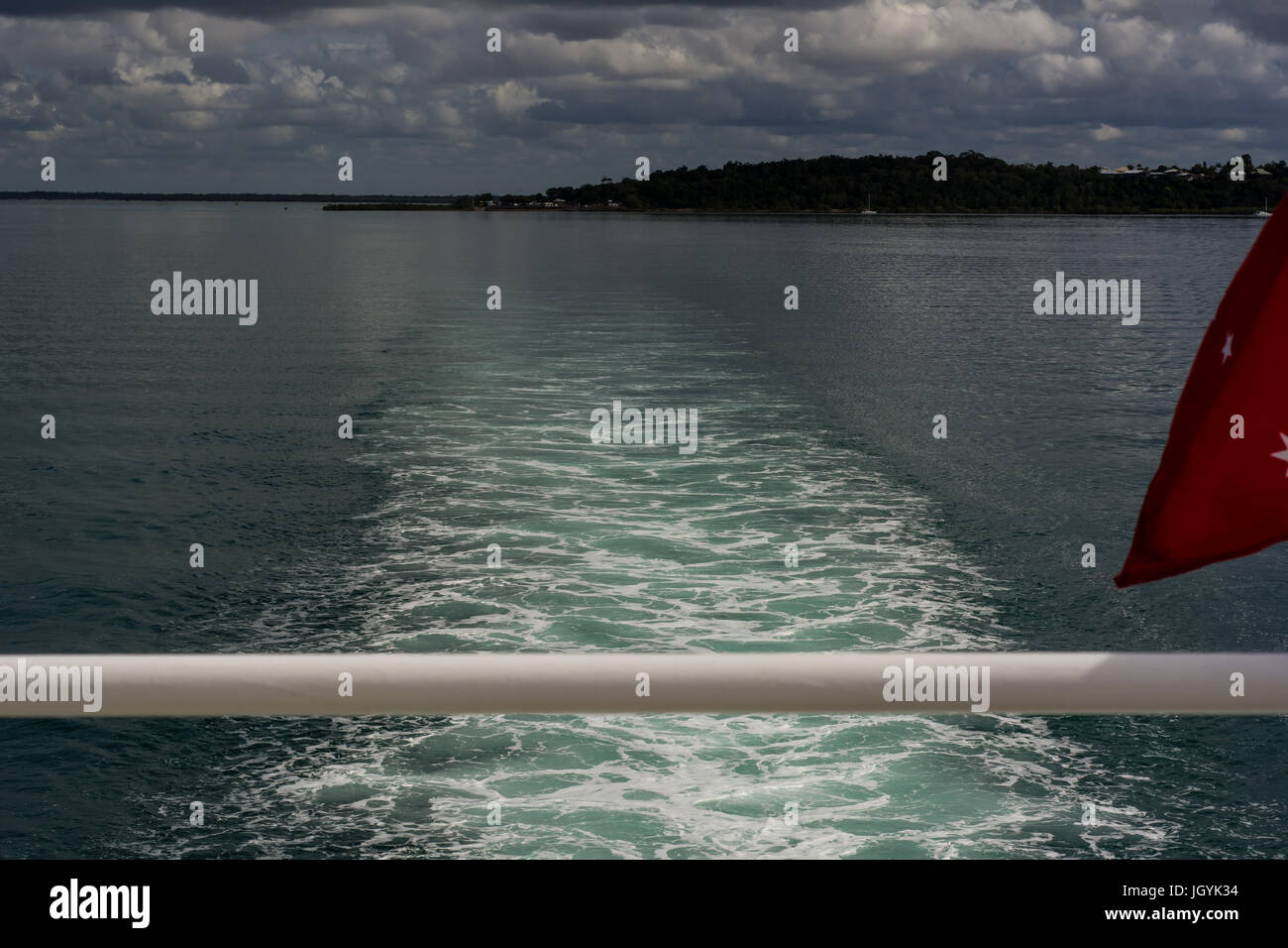 Looking out over the back of a ferry with the wake in view crossing to ...