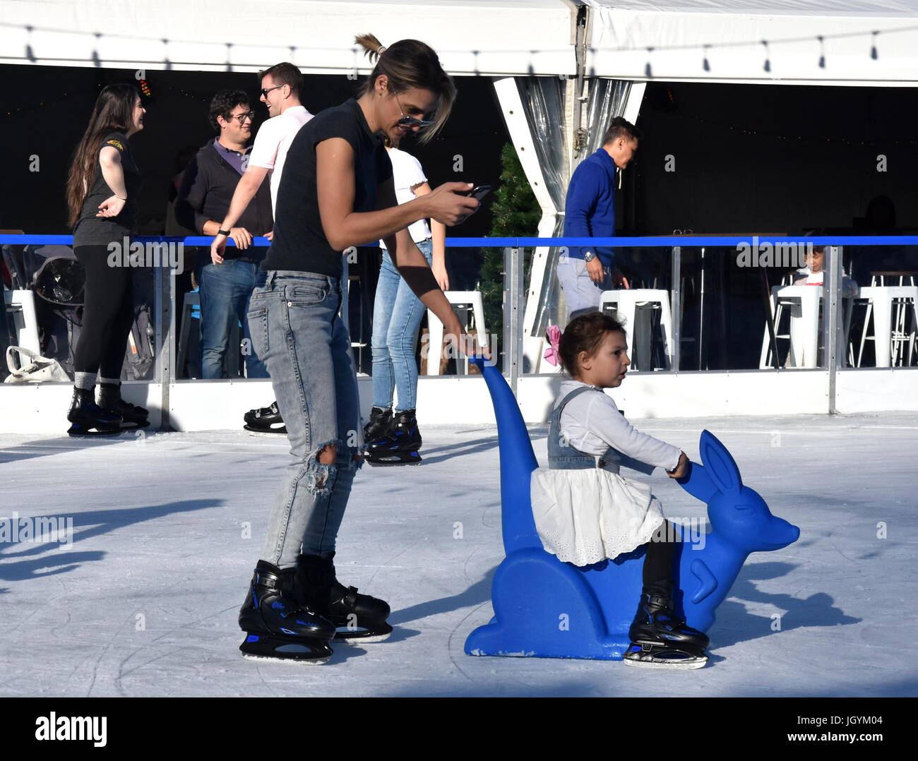 Sydney, Australia - Jun 25, 2017. Kids and parents ice skating at Hyde ...