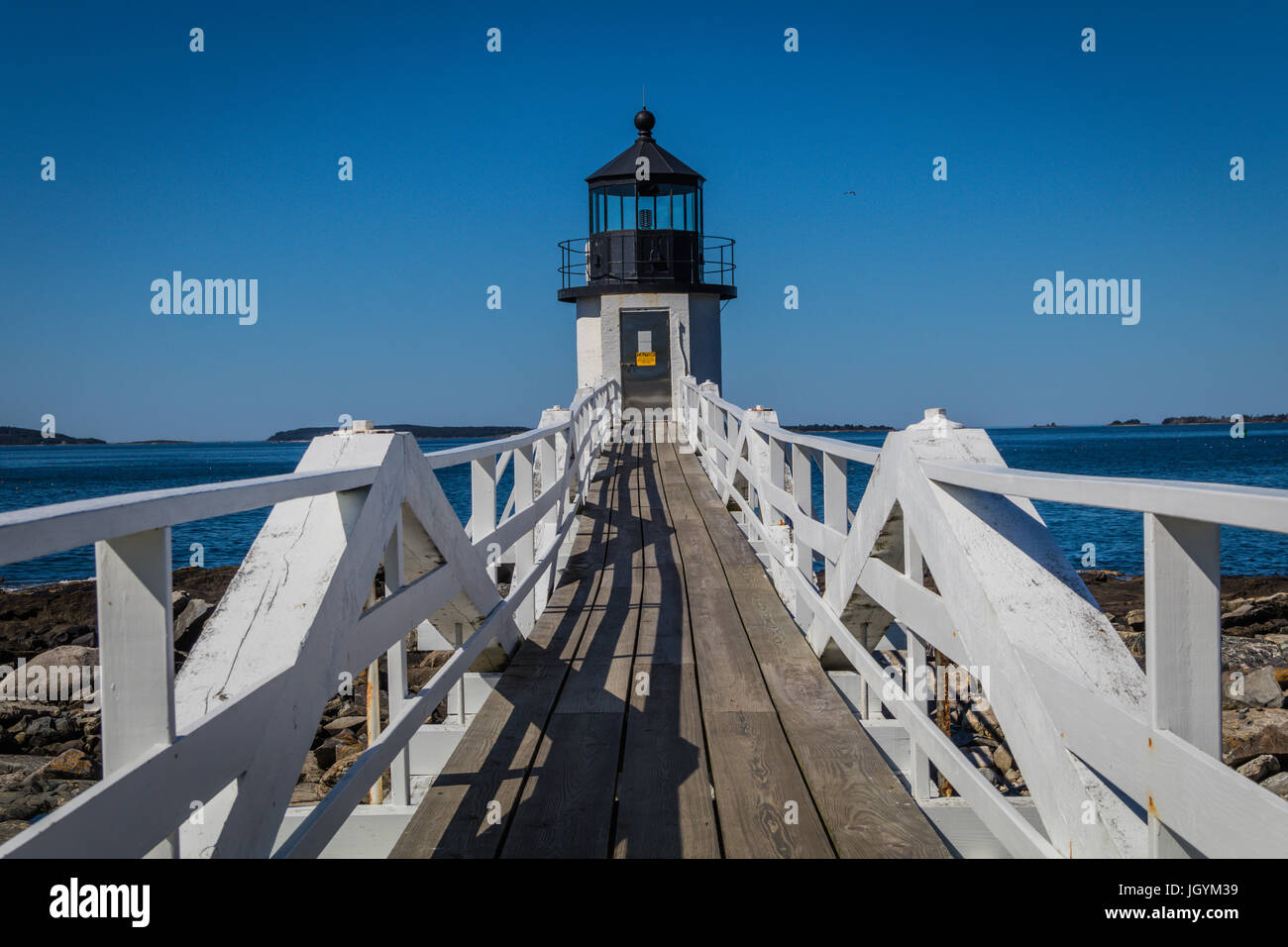 Marshall Point Lighthouse against a bright blue sky in Port Clyde ...