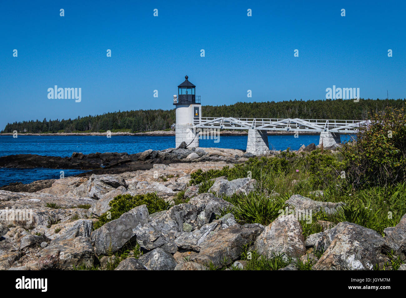 Marshall Point Lighthouse against a bright blue sky in Port Clyde ...