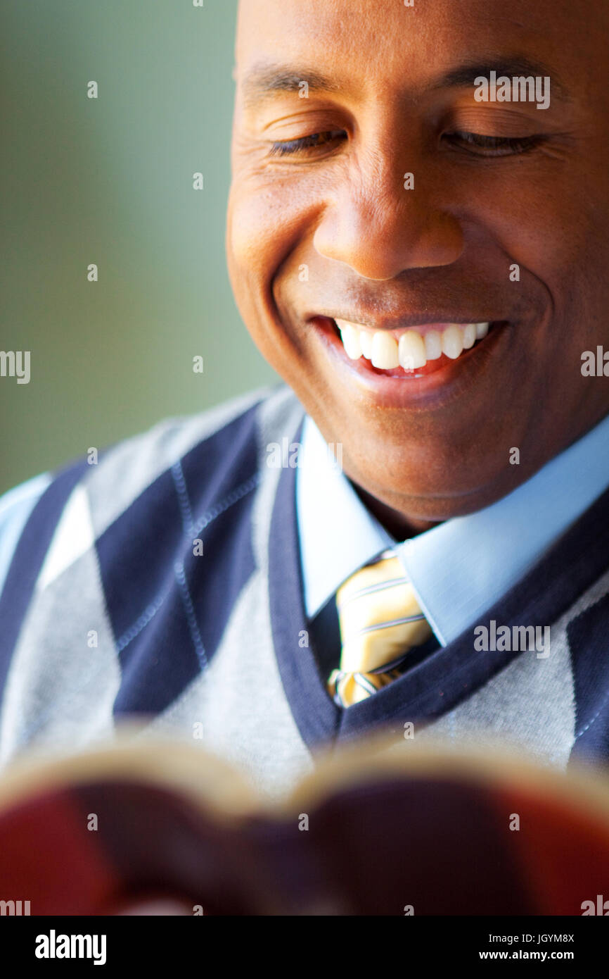 African American man reading the Bible at home Stock Photo - Alamy