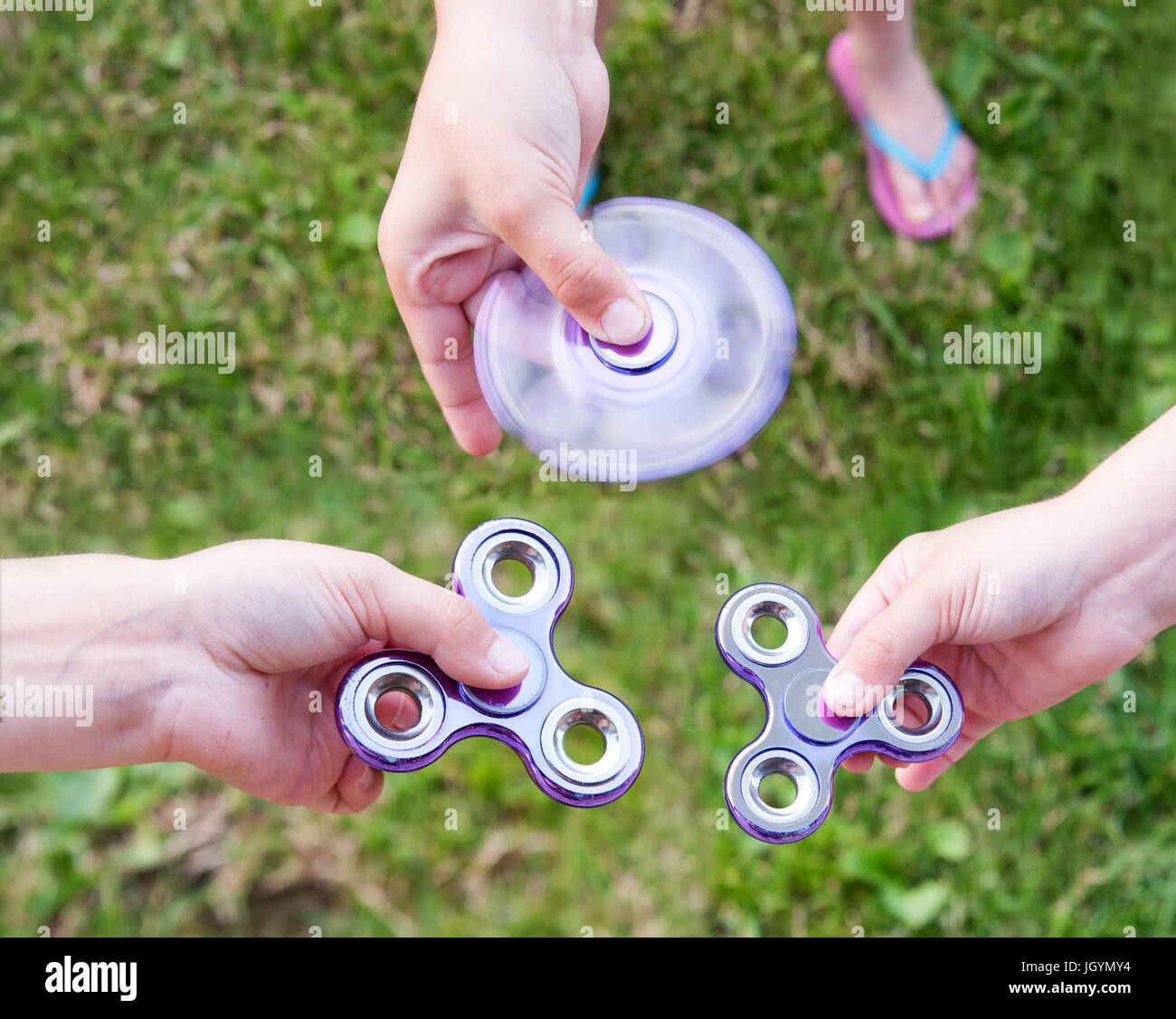 three fidget spinners. A close up Stock Photo - Alamy