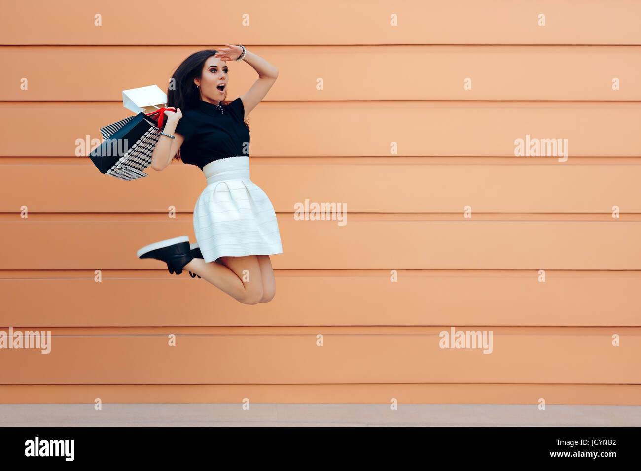 Surprised Woman Running With Shopping Bags in Summer Sale Season Stock ...