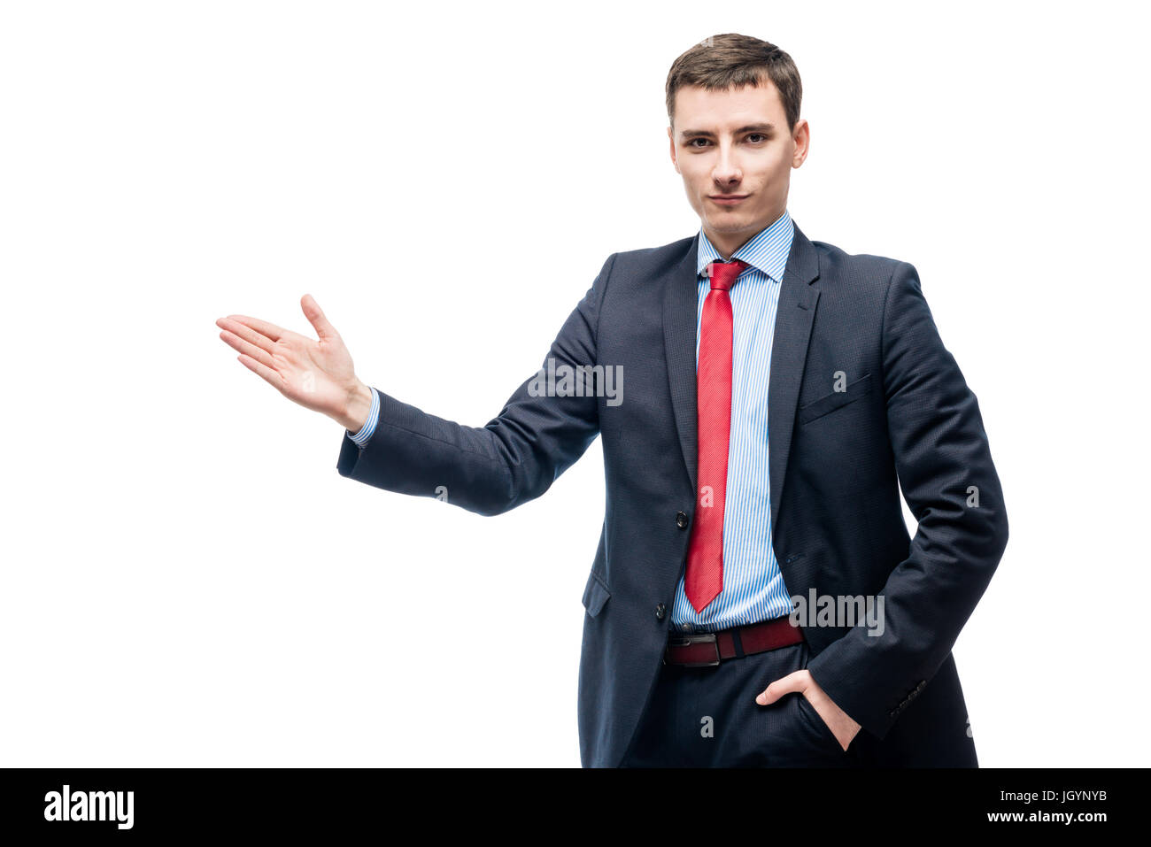 Young businessman showing his hand on something on a white background ...