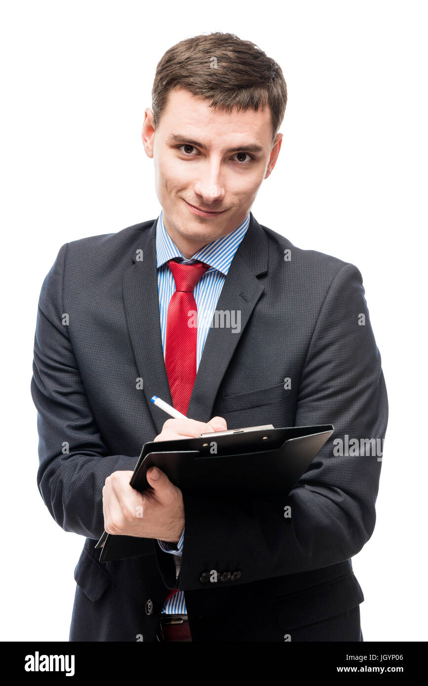 Portrait of a successful businessman signing an important contract ...