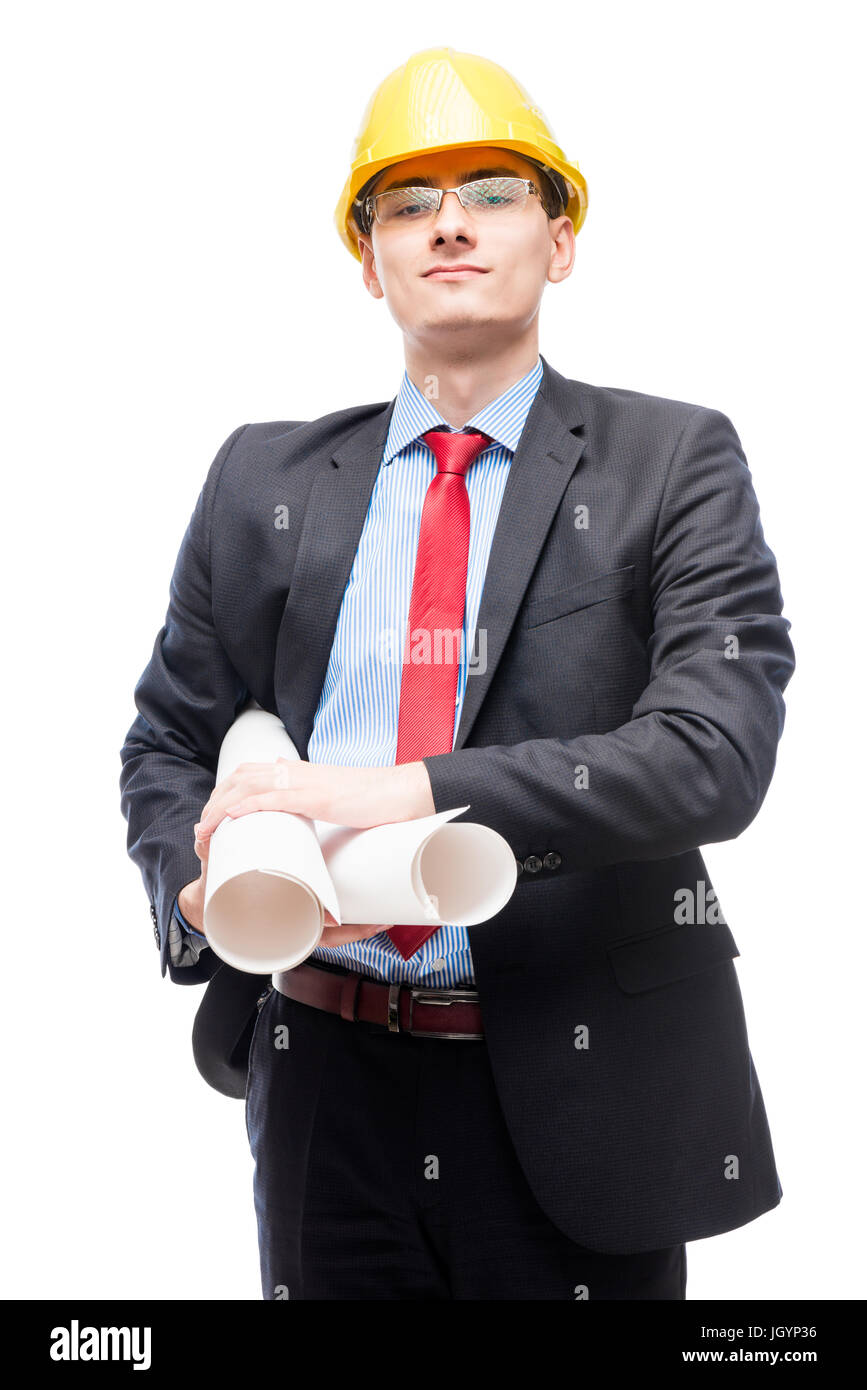 Serious architect in suit and yellow helmet with blueprints on white ...