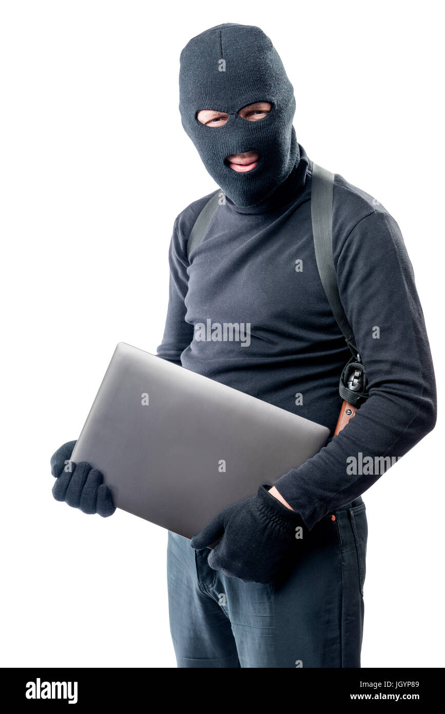 Thief in a balaclava with a laptop on a white background Stock Photo ...