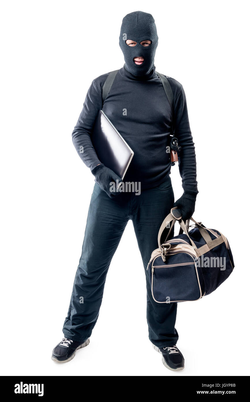 Robber with a bag and a laptop in full length on a white background ...