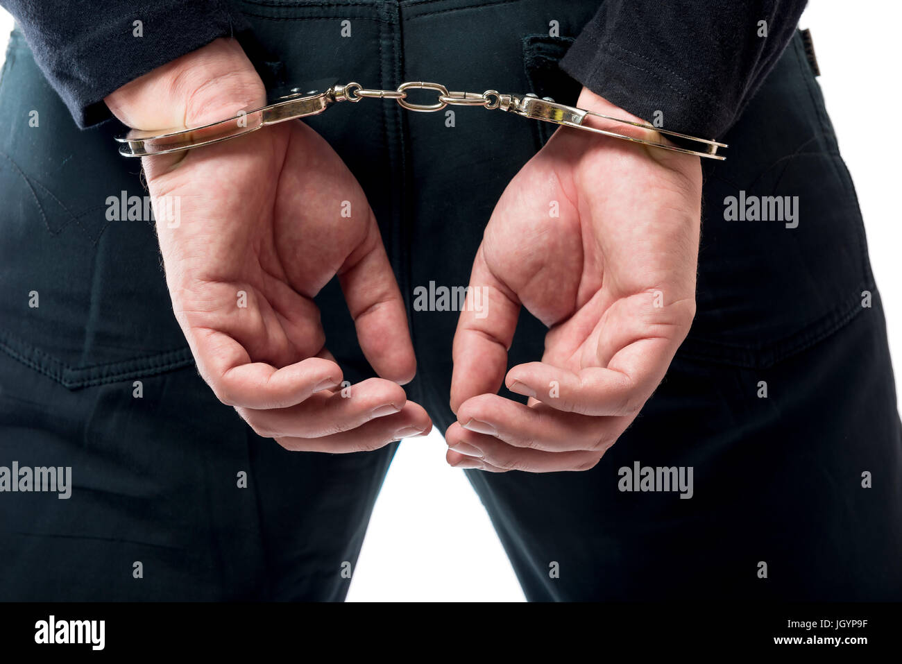 Robber in handcuffs hi-res stock photography and images - Alamy