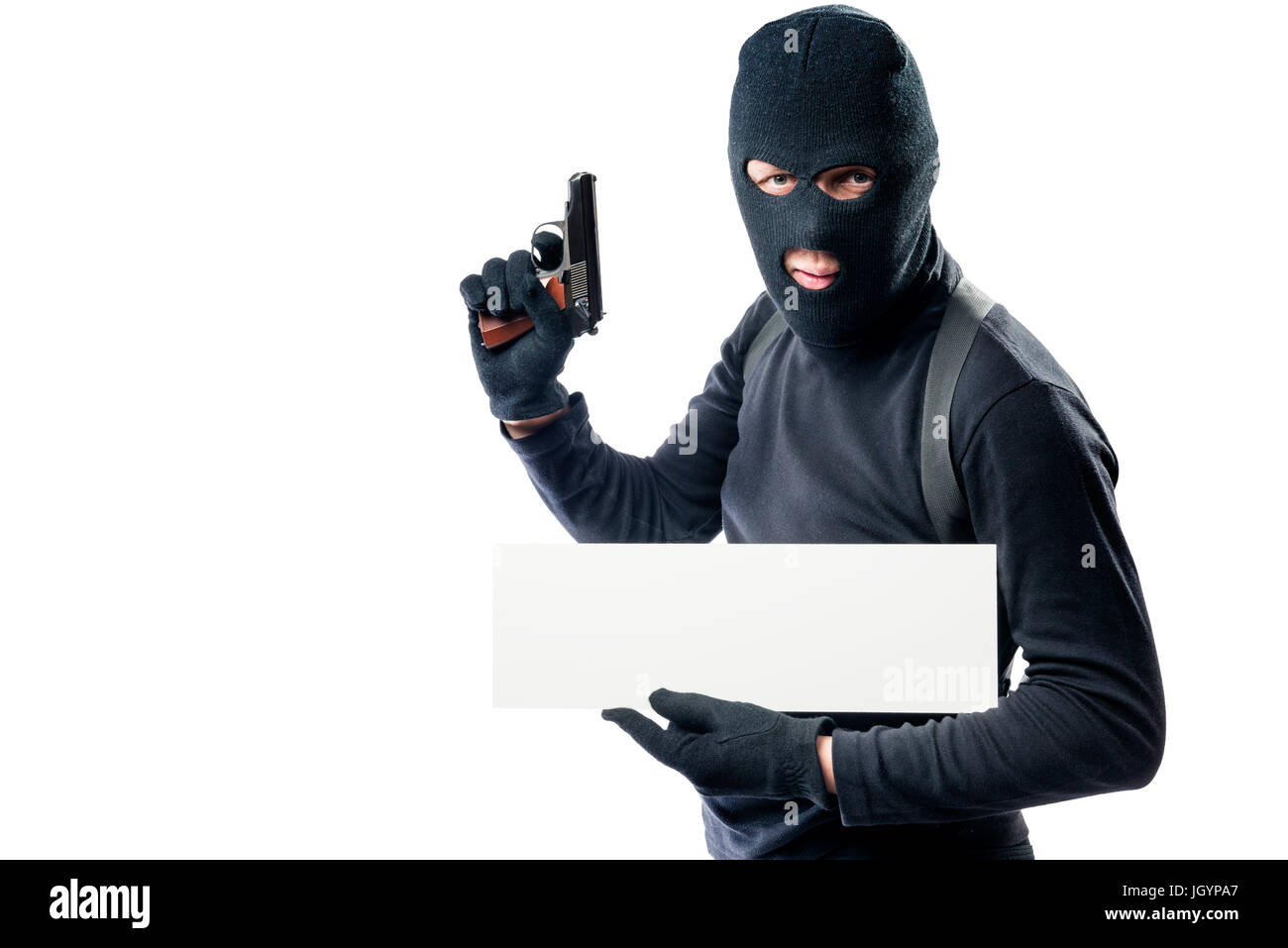 Portrait of an armed man in black clothes with a poster on a white ...