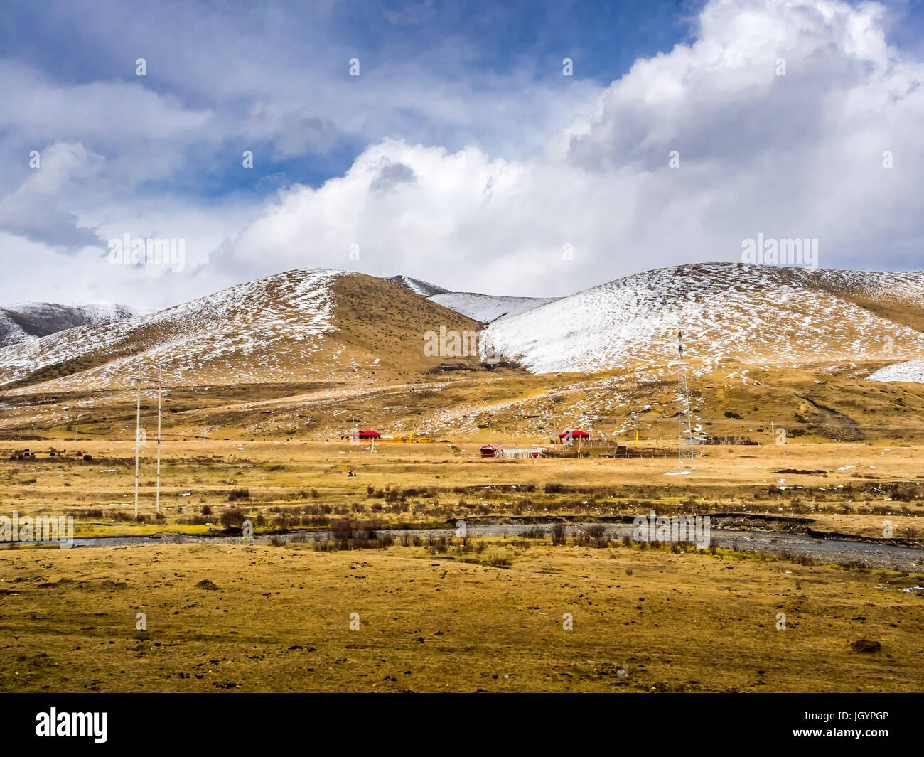 View of rural houses at the snow mountain in Sichuan, China Stock Photo ...