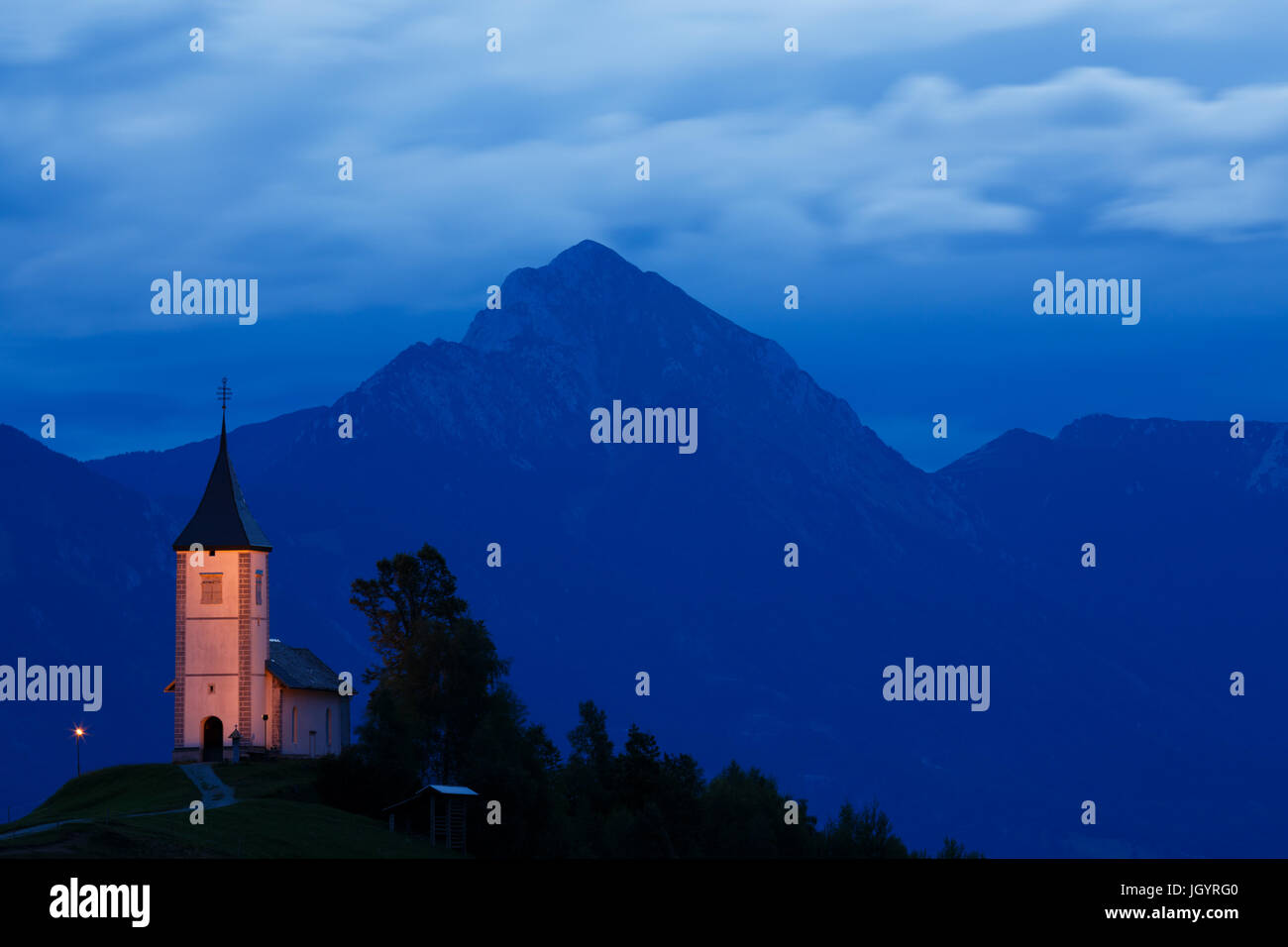 Jamnik church of Saints Primus and Felician at dawn, perched on a hill ...
