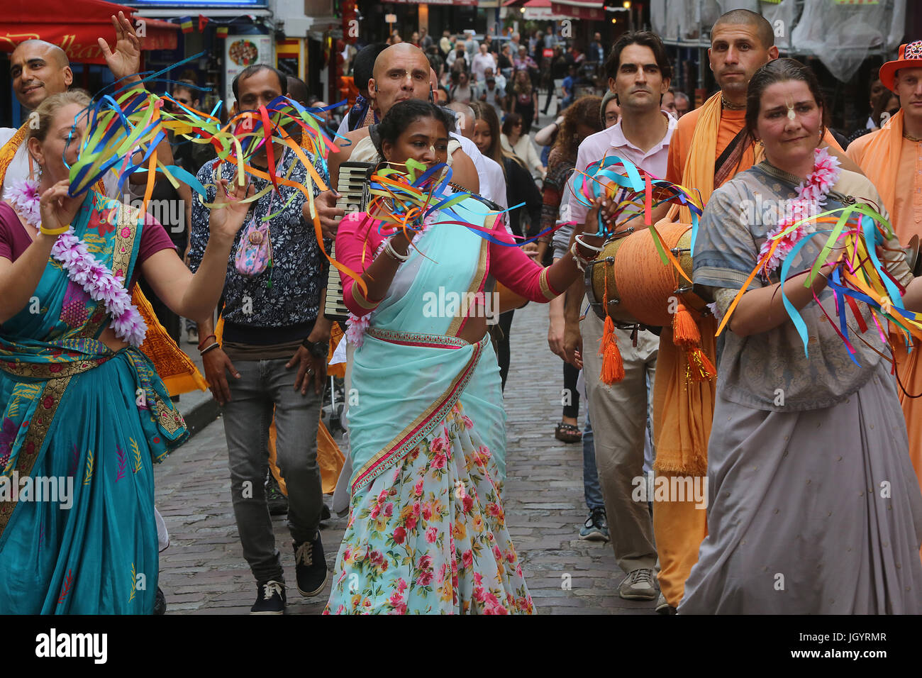 ISKCON devotees performing a harinam (devotional walk with dancing and ... ISKCON devotees performing a harinam (devotional walk with dancing and ...