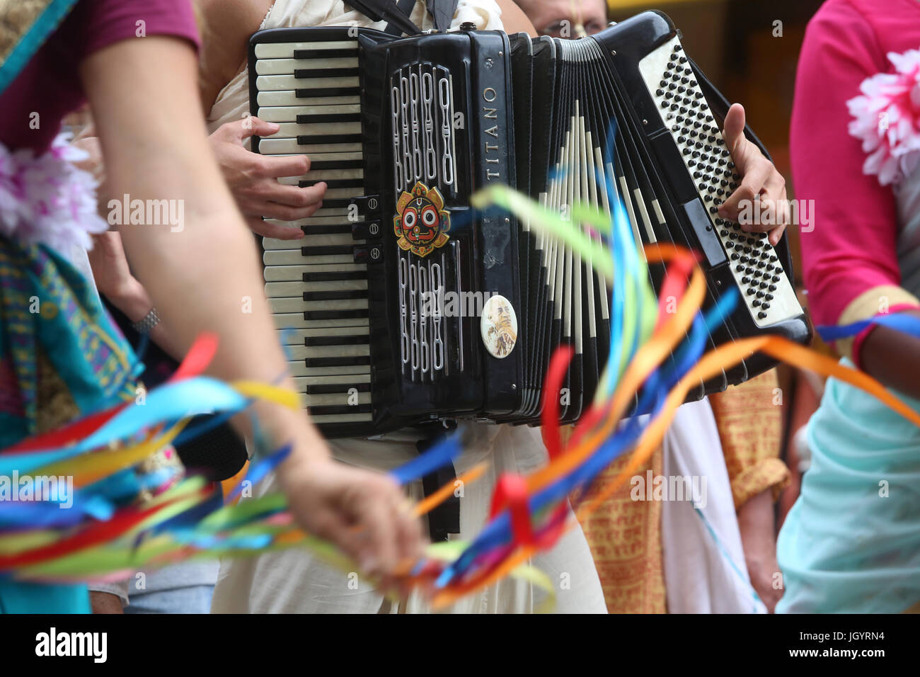 ISKCON devotees performing a harinam (devotional walk with dancing and ...