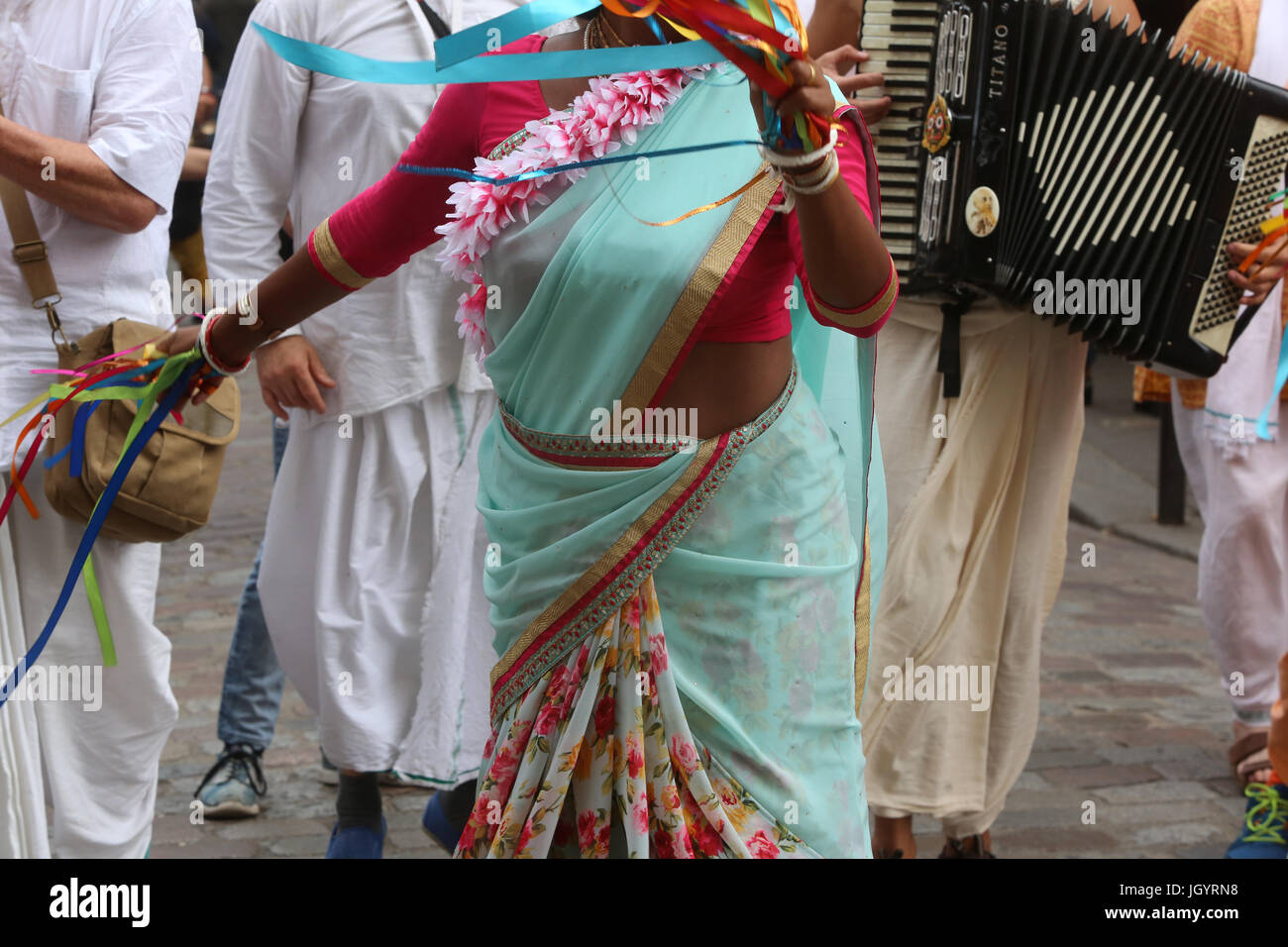 ISKCON devotees performing a harinam (devotional walk with dancing and ...