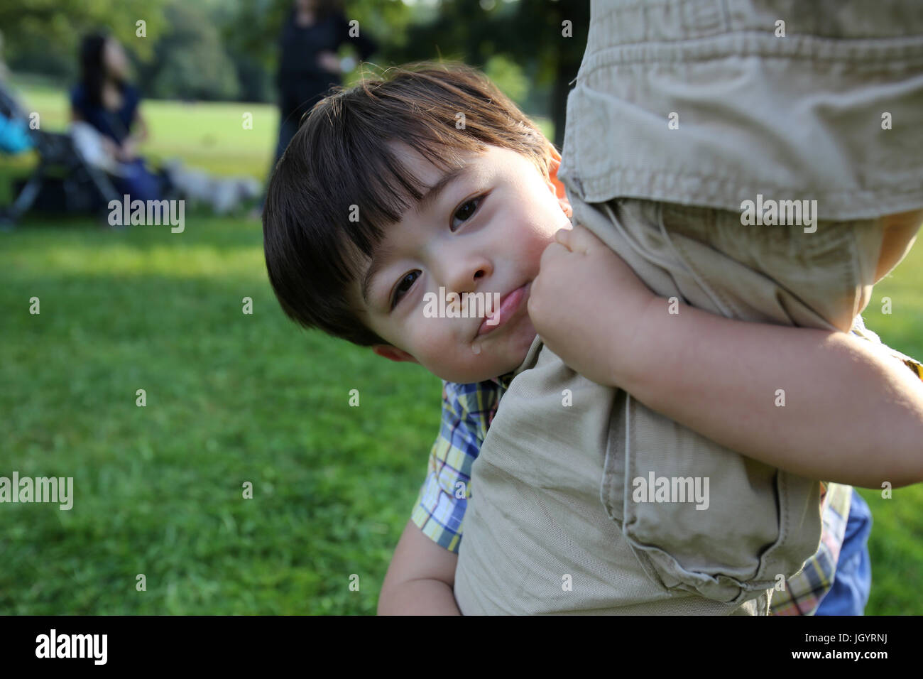 Child clinging to parent hi-res stock photography and images - Alamy